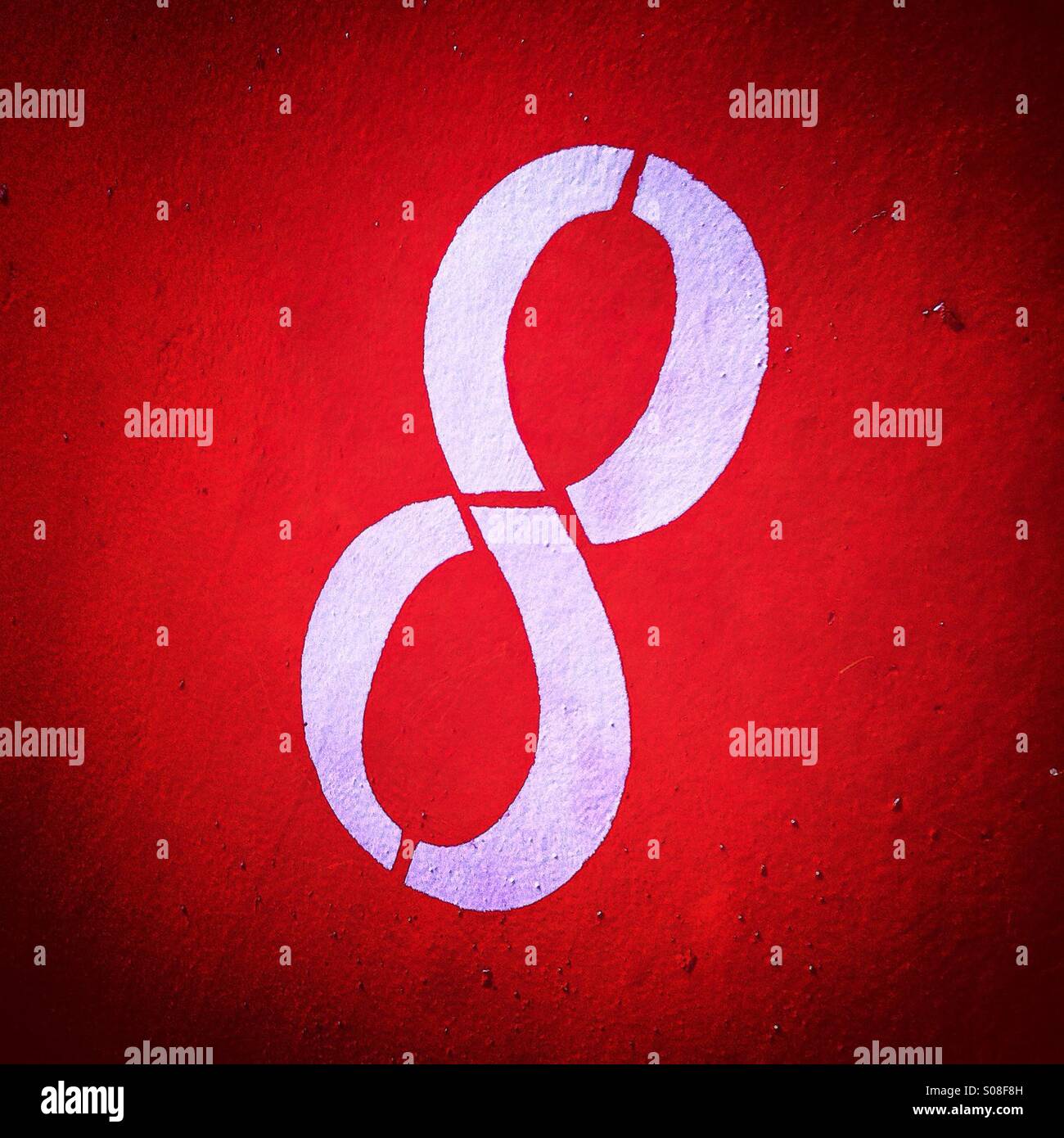 Lucky number 8 painted in white in a stencil style Stock Photo - Alamy