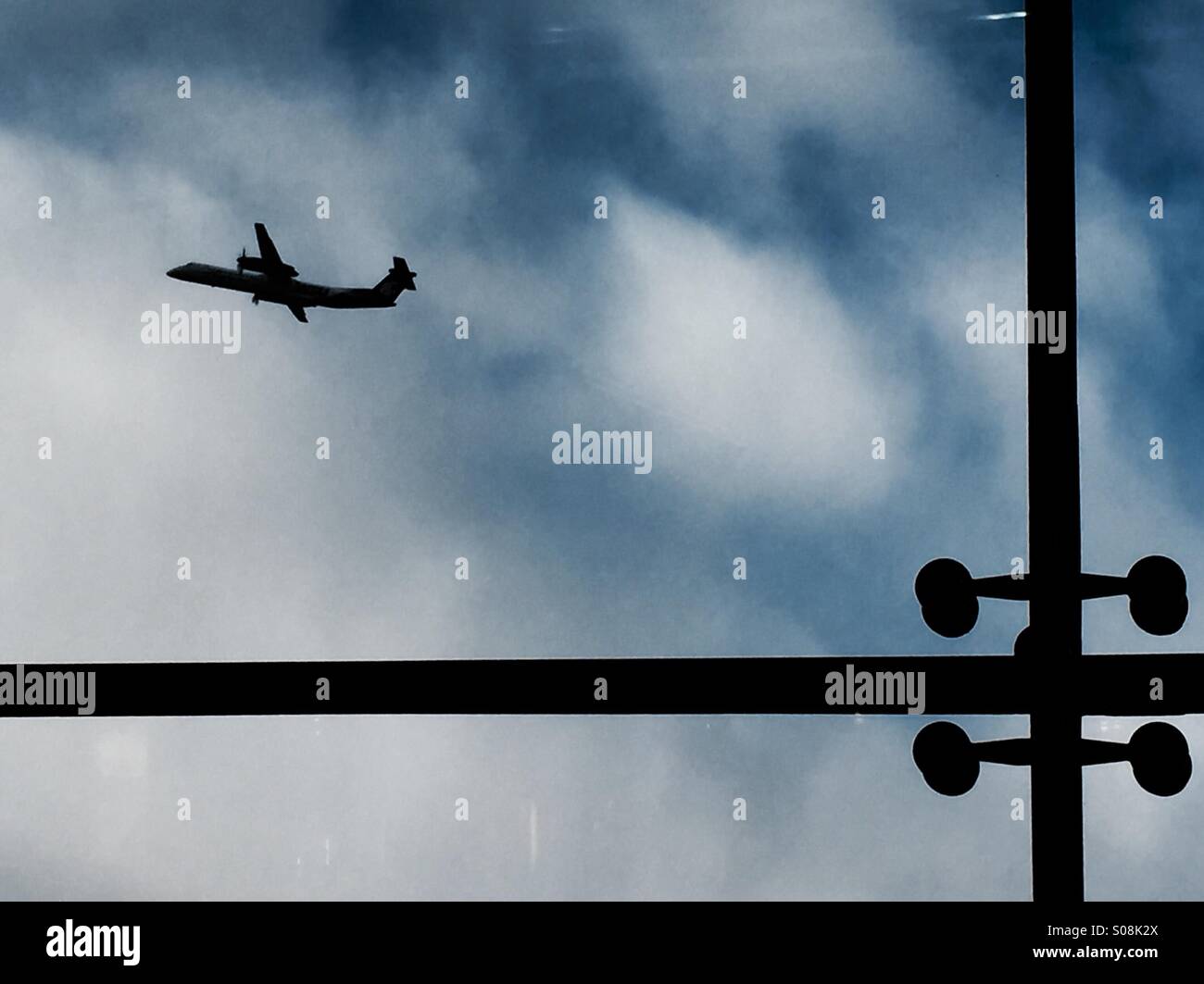 A shot taken from the inside of an airport of an airplane taking flight ...