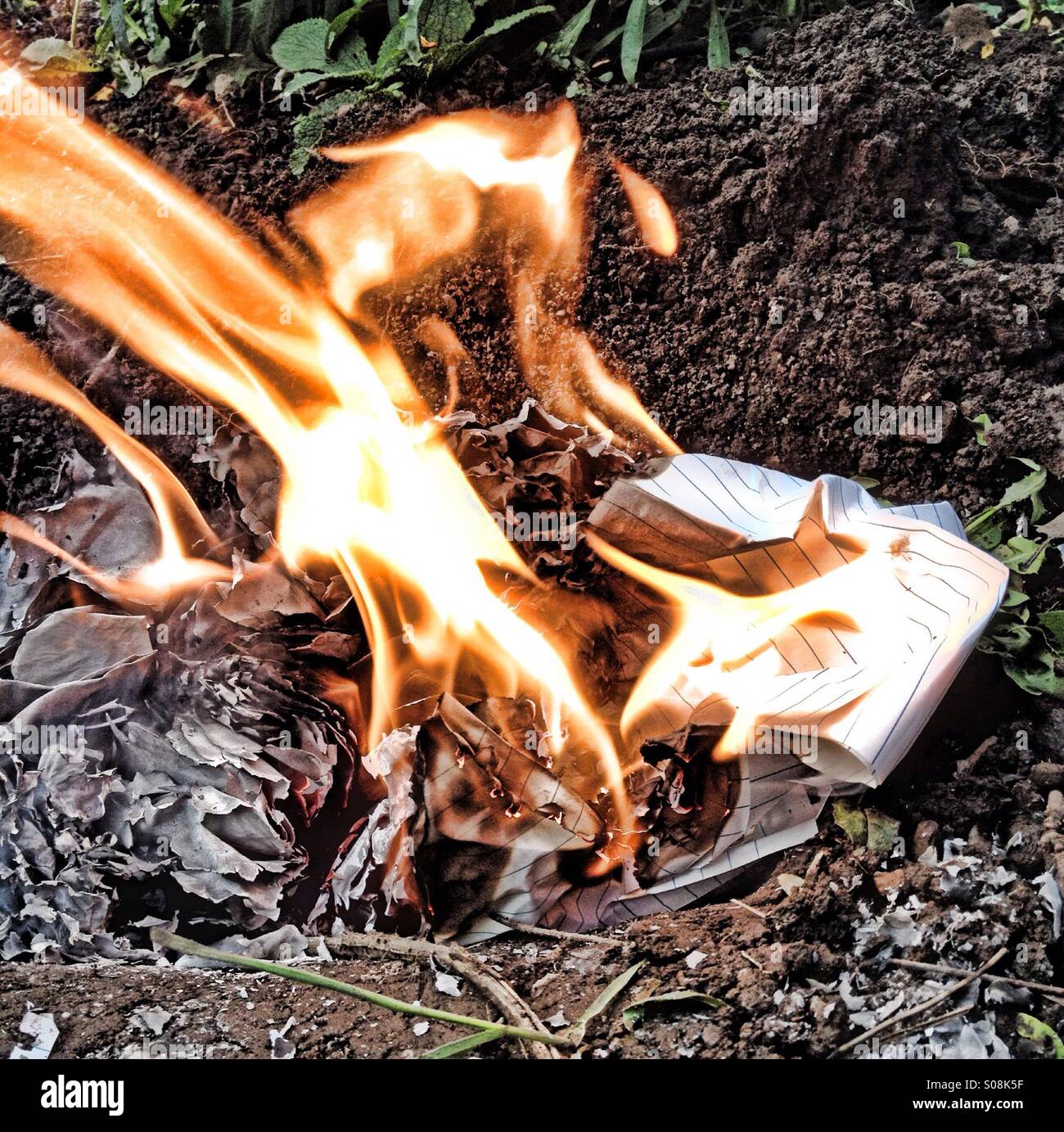 Rubbish on fire Stock Photo - Alamy