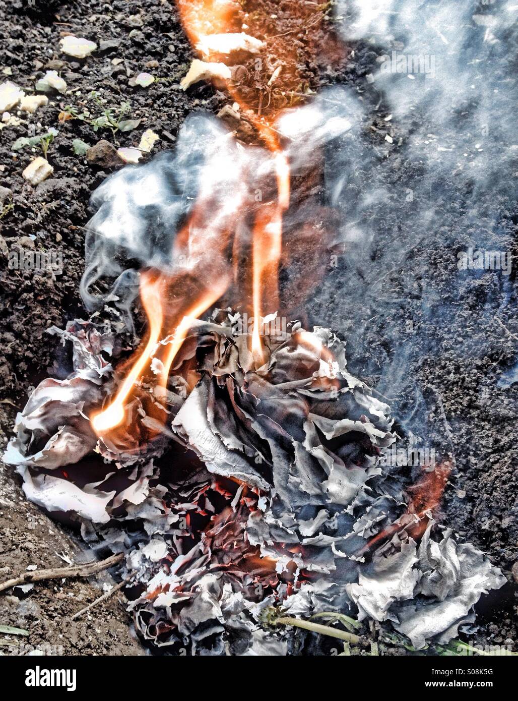 Rubbish on fire Stock Photo - Alamy