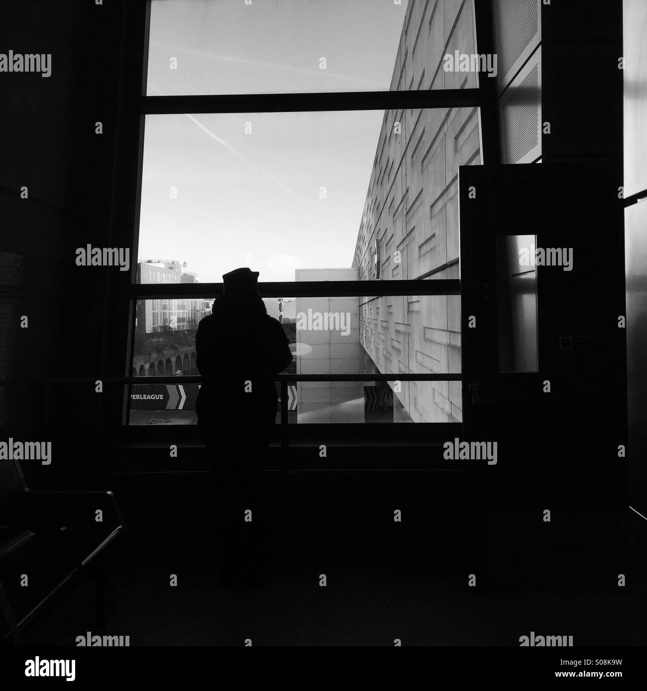 A person looking through the window Stock Photo - Alamy