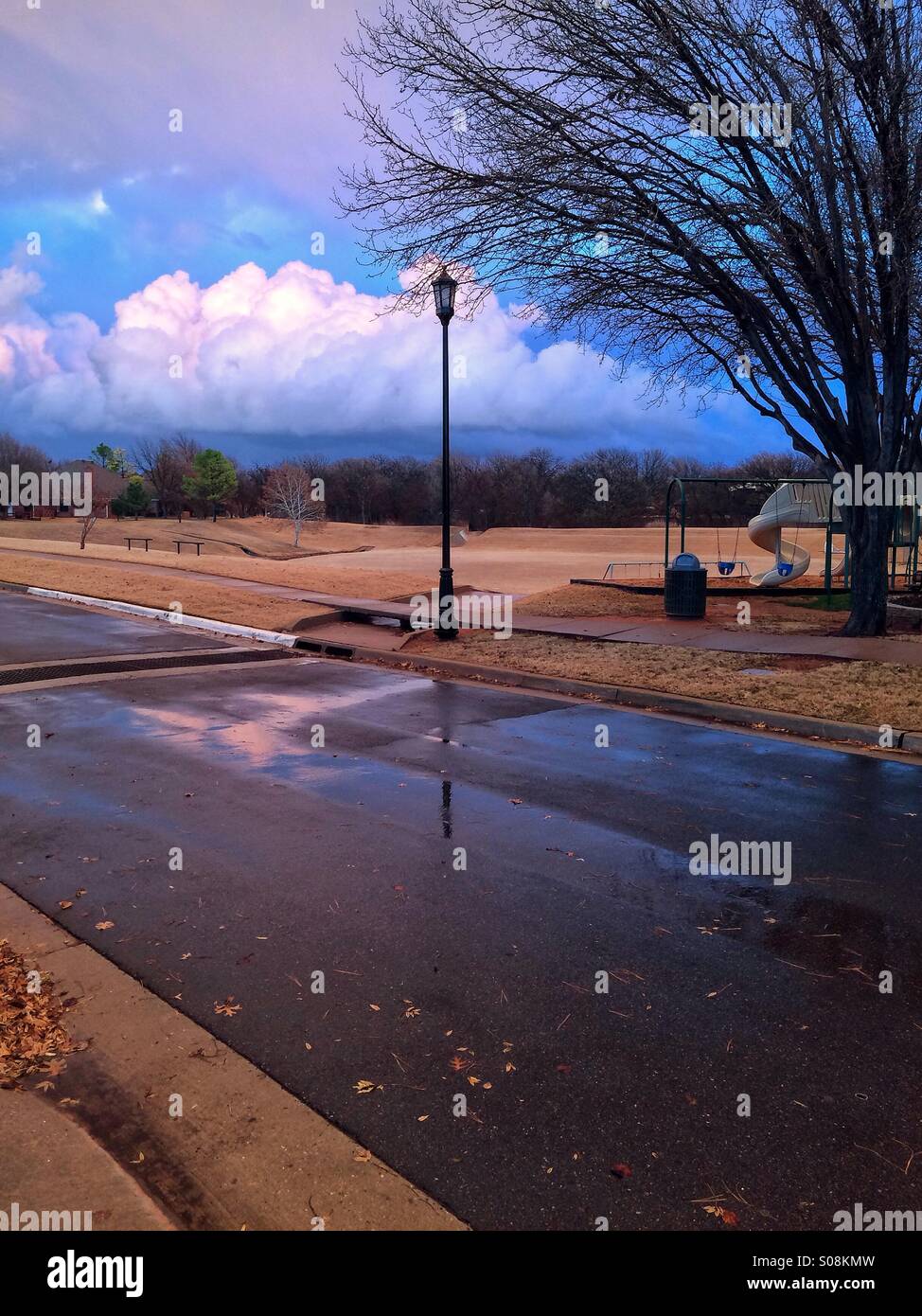 Beautiful clouds and sky are a street side backdrop Stock Photo - Alamy