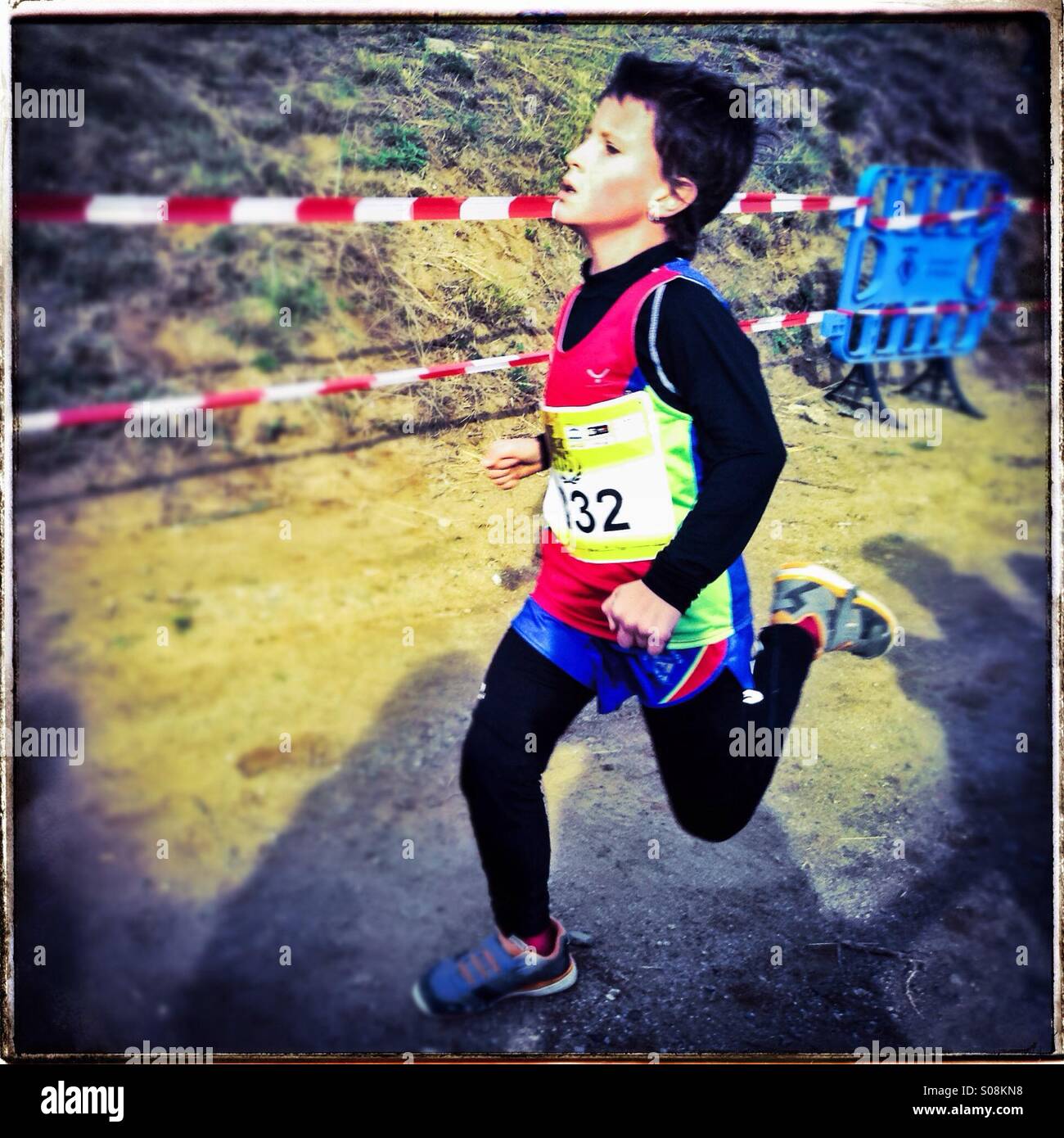 Boy running a race Stock Photo - Alamy