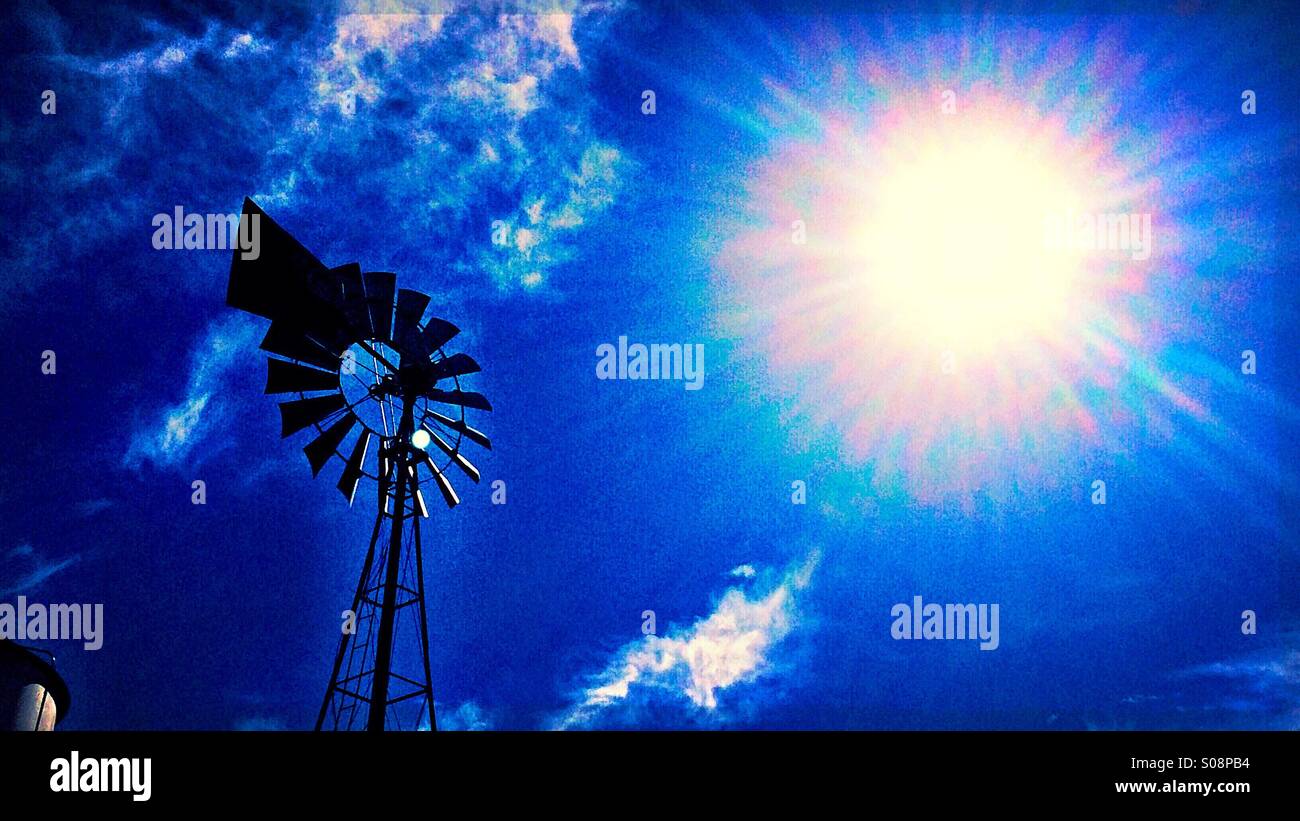Windmill and Sun at the Empire Ranch, Arizona Stock Photo - Alamy