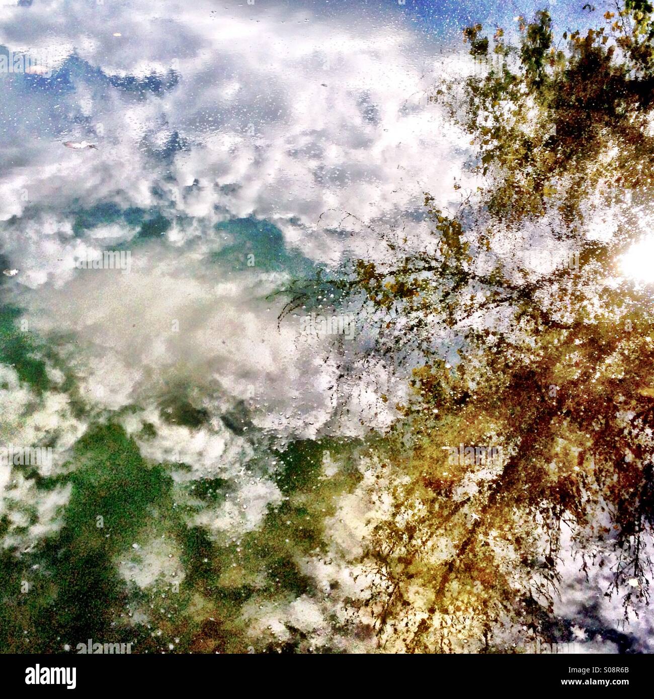 Clouds reflect in a lake hi-res stock photography and images - Alamy