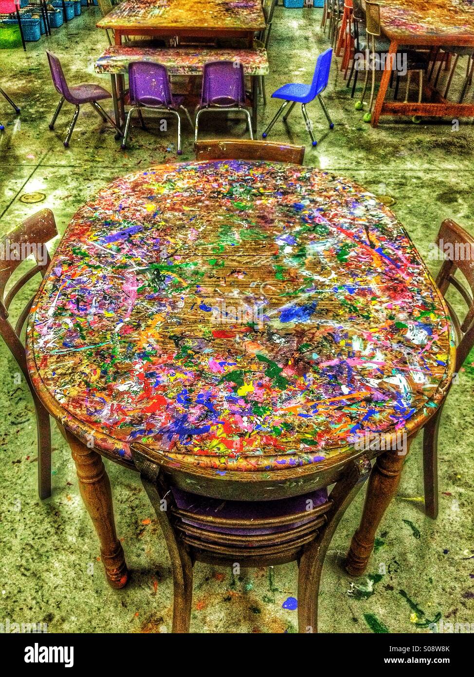 Paint splattered round table Stock Photo - Alamy