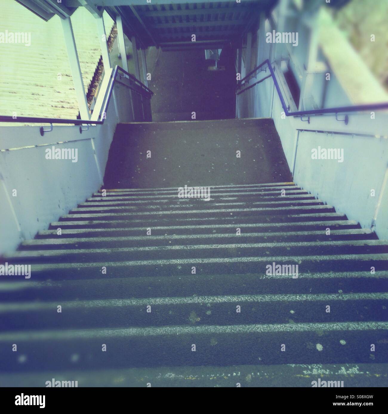 Looking down train station steps Stock Photo - Alamy