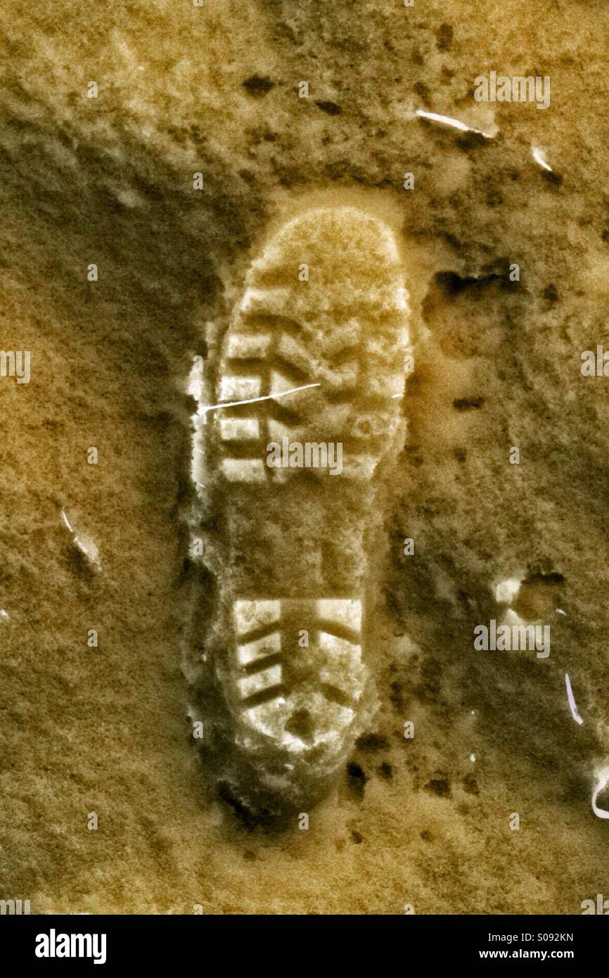 Inverted photo of footprint in snow Stock Photo - Alamy