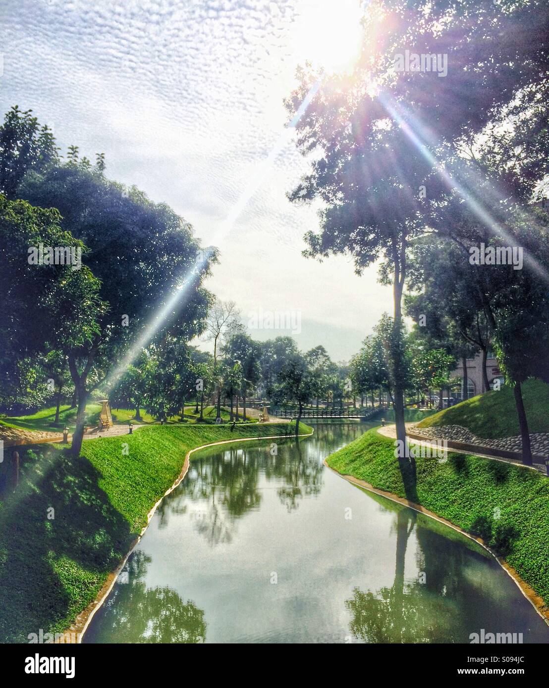 View over a lake in a park Stock Photo - Alamy