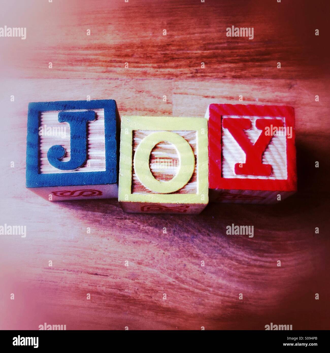 Joy written in wooden alphabet blocks Stock Photo - Alamy