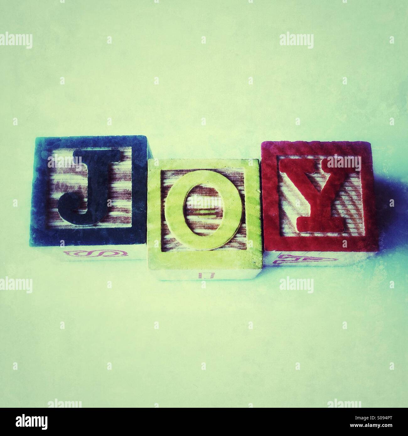Joy written in wooden alphabet blocks Stock Photo - Alamy