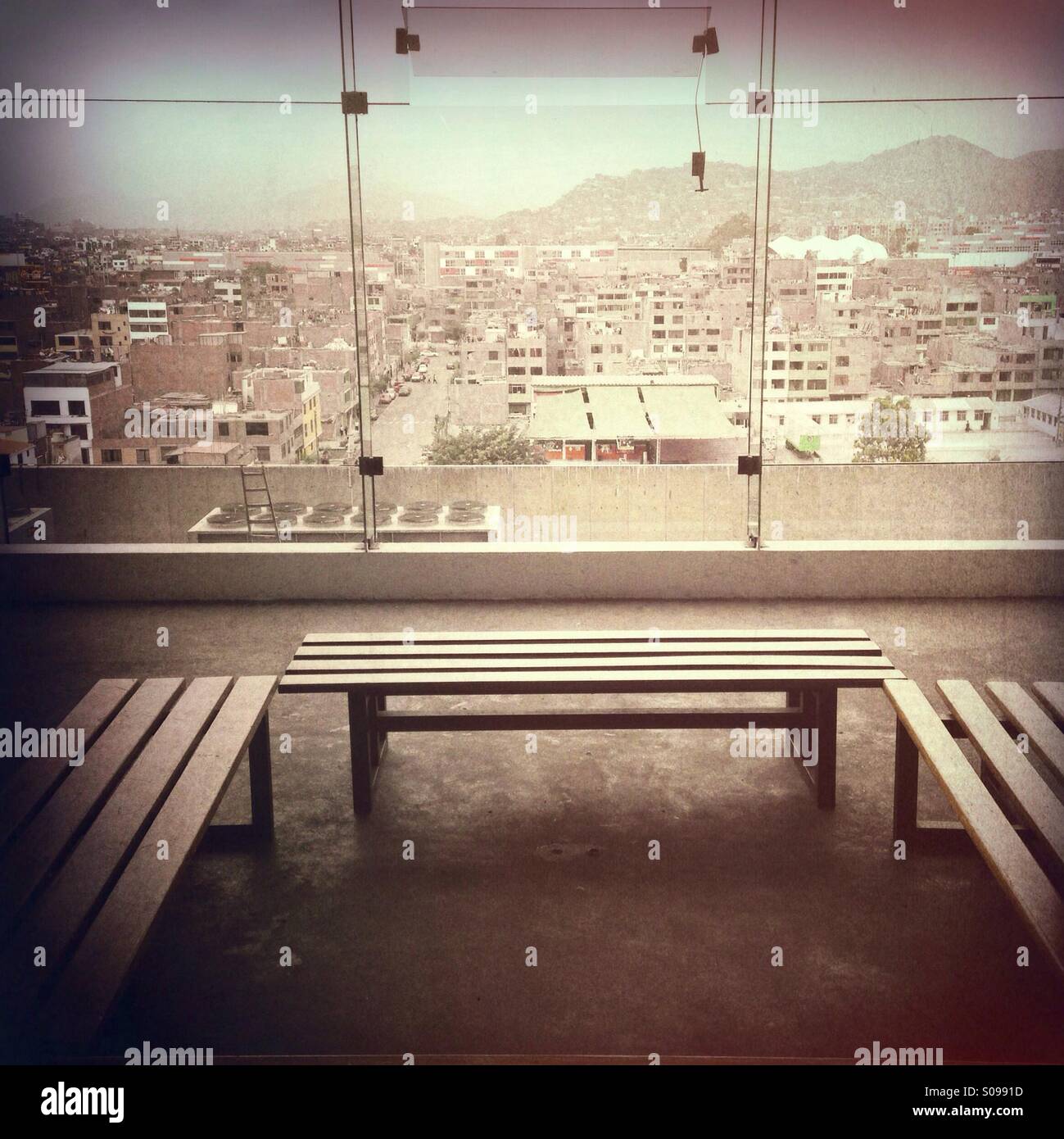 Empty benches look out over sprawling Lima Stock Photo - Alamy