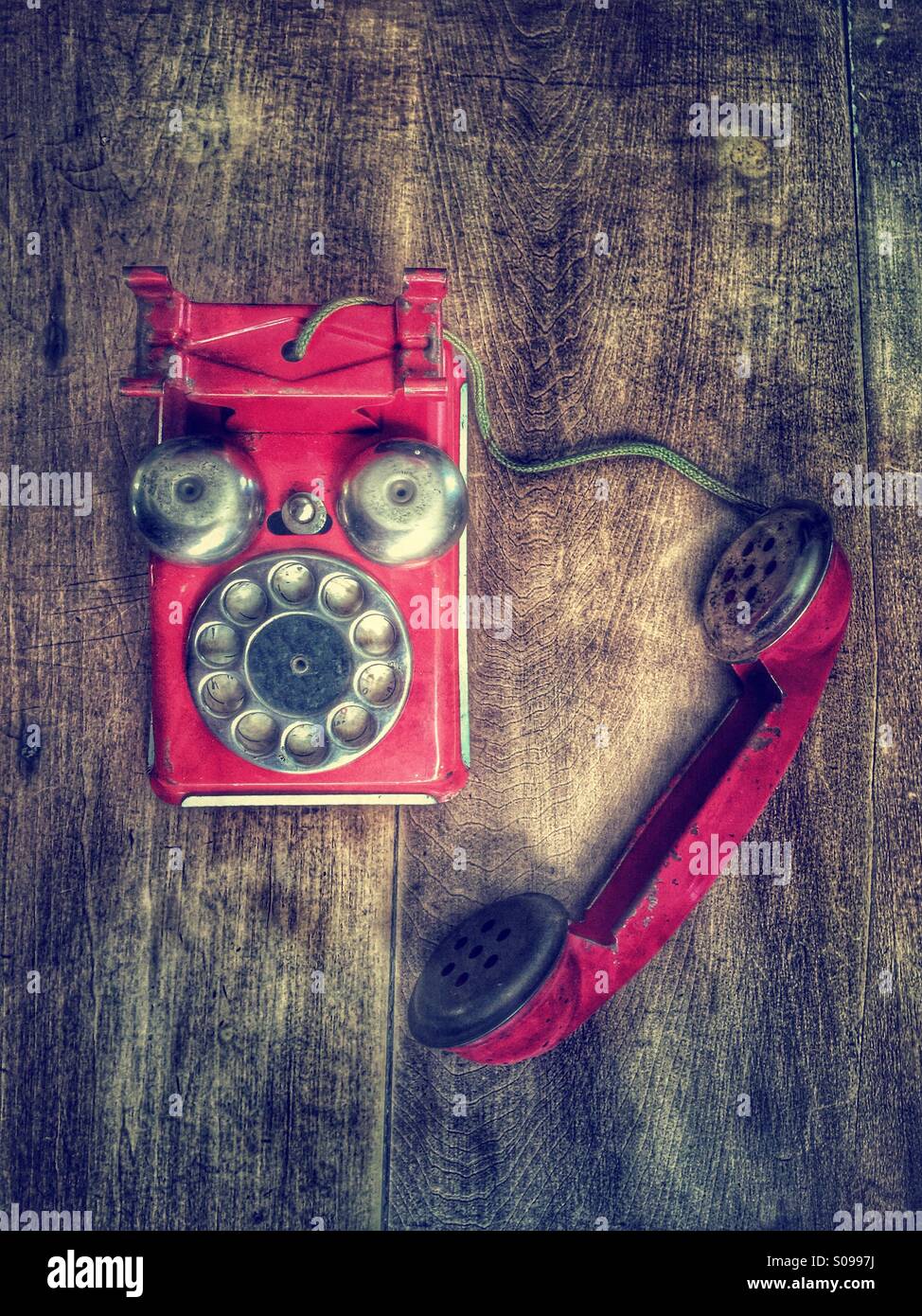 Red vintage toy telephone Stock Photo - Alamy