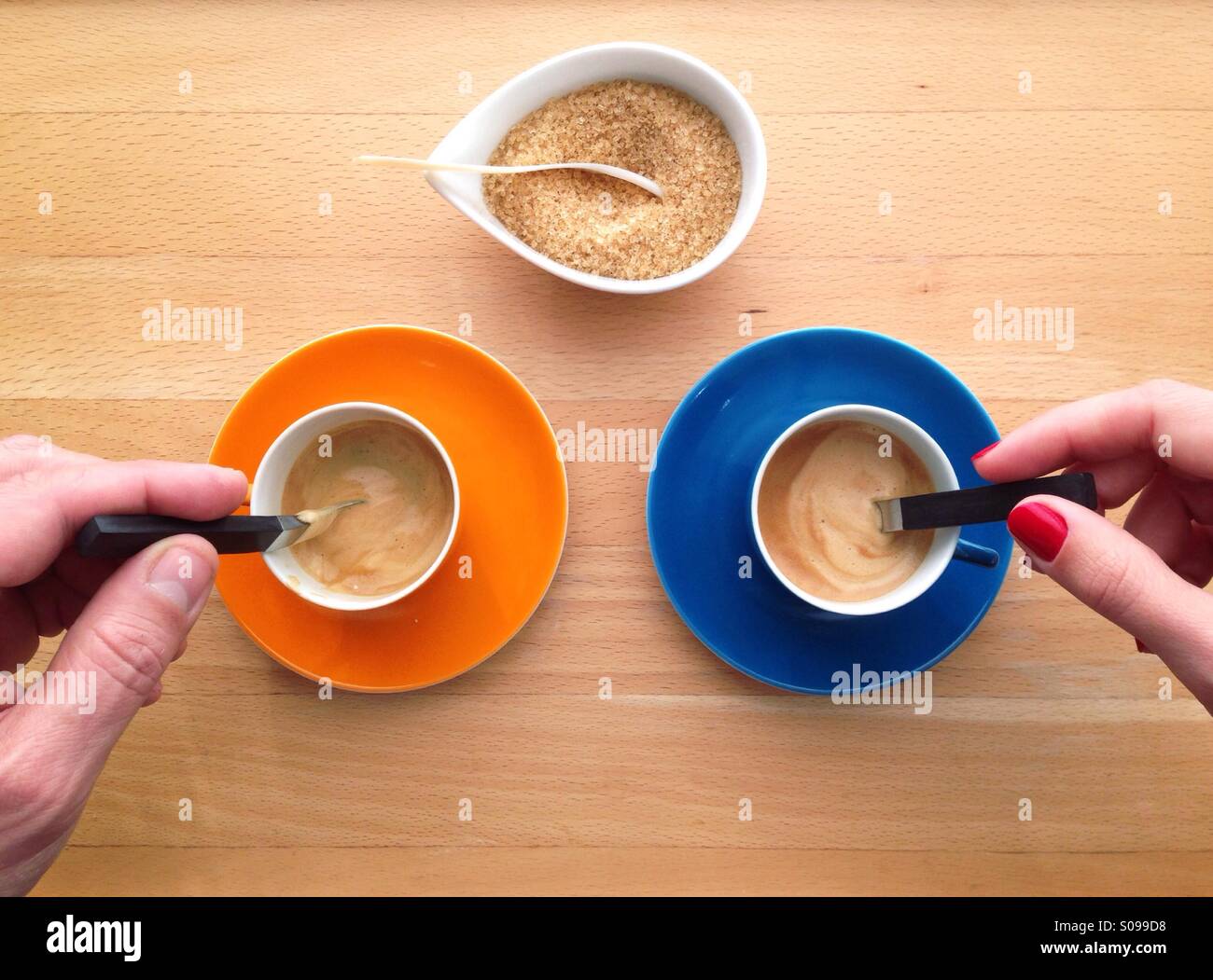 Hand stirring cup of coffee Stock Photo - Alamy