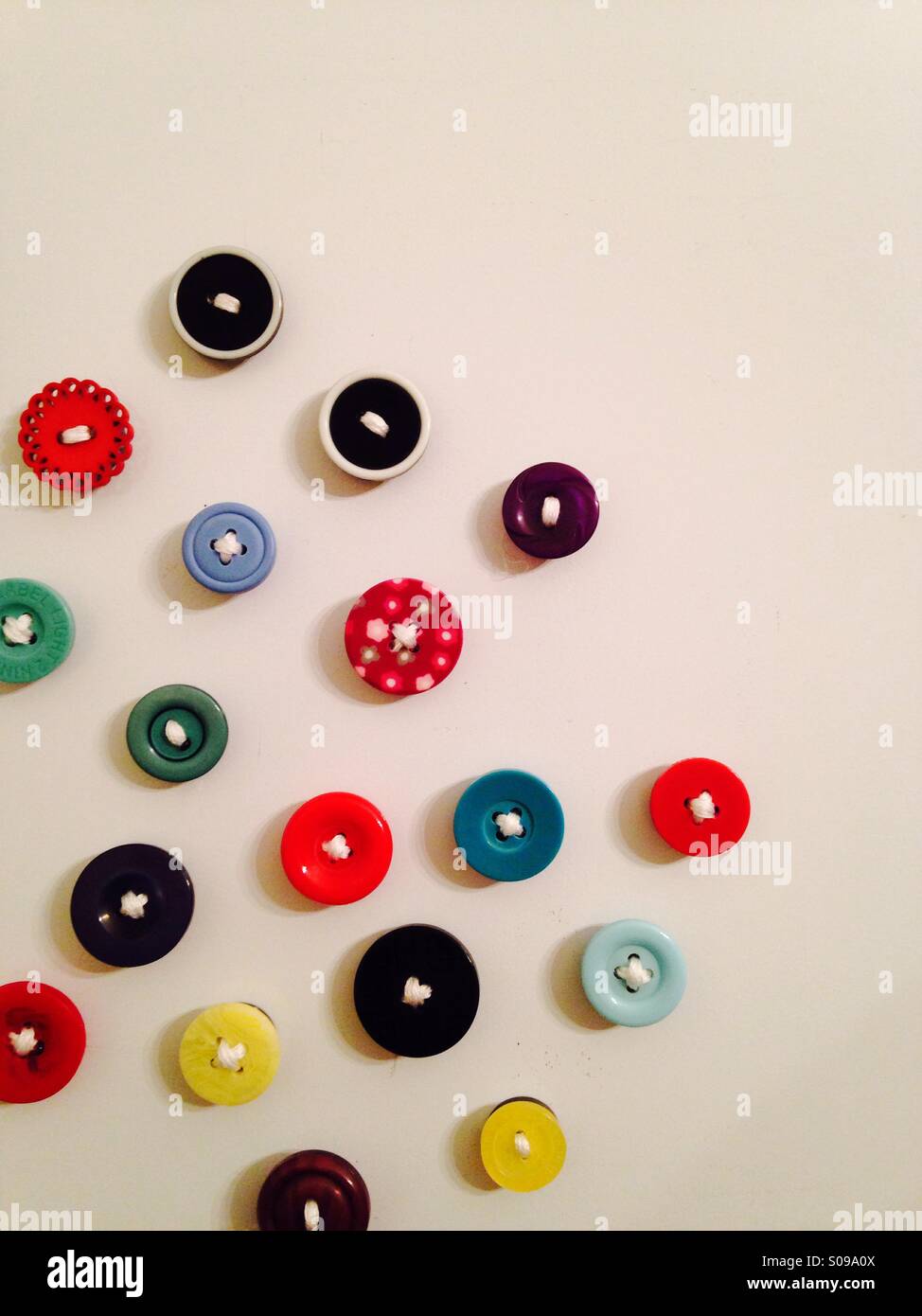 A collection of handmade button fridge magnets Stock Photo - Alamy