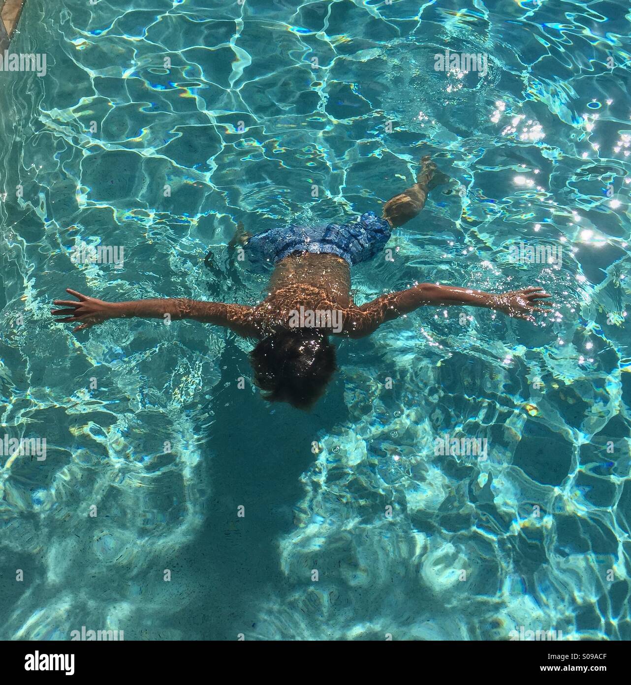 Boy in water Stock Photo - Alamy