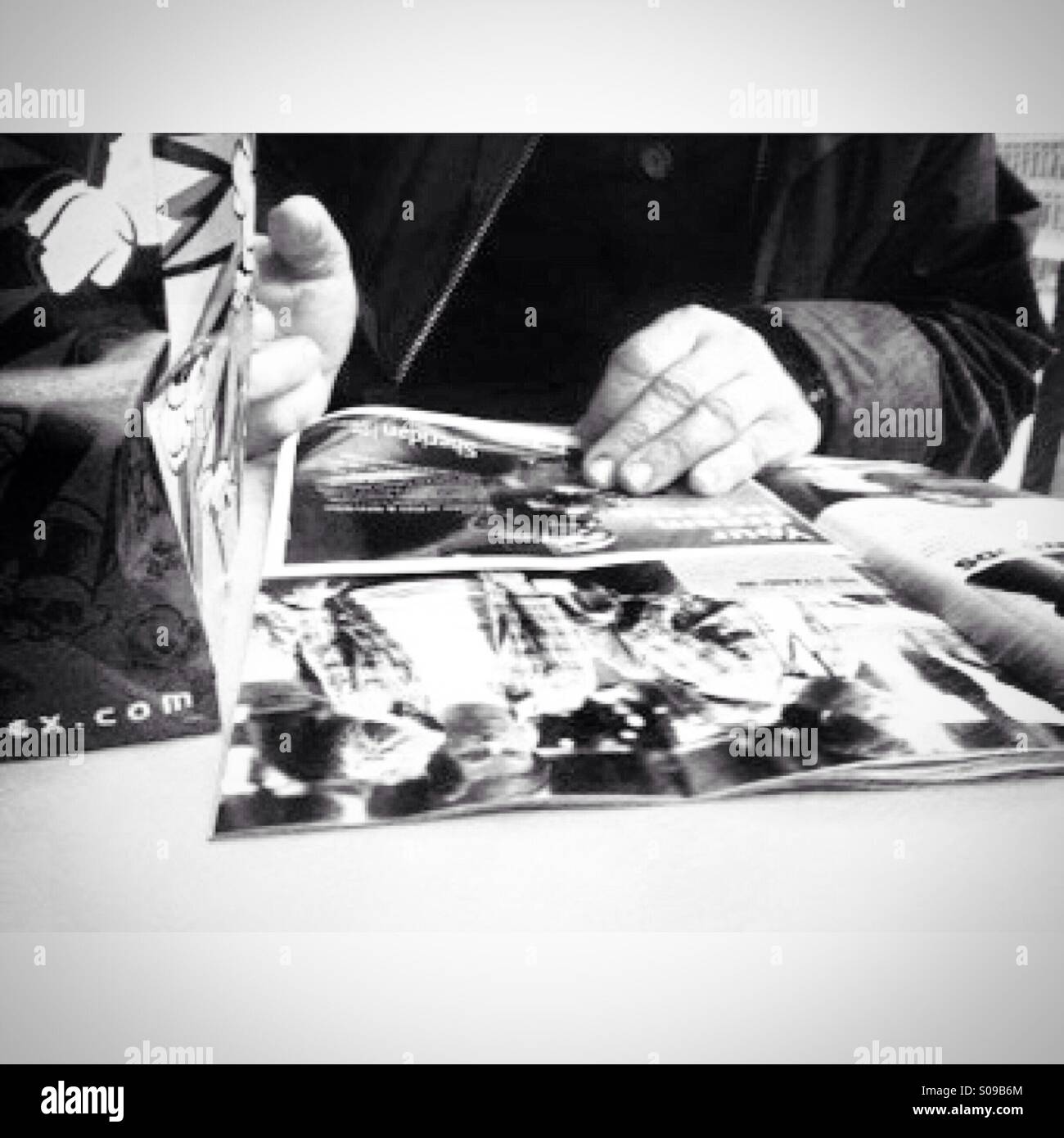 Flipping through hi-res stock photography and images - Alamy