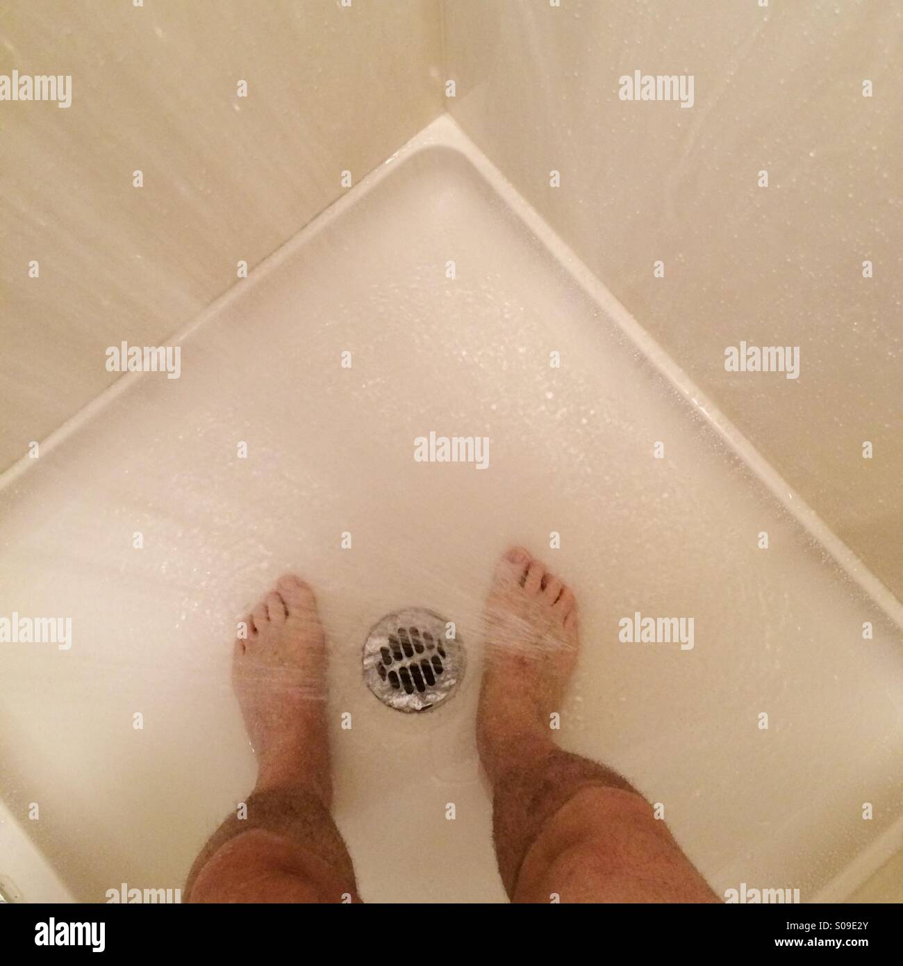 Man, standing in shower, first person perspective Stock Photo - Alamy