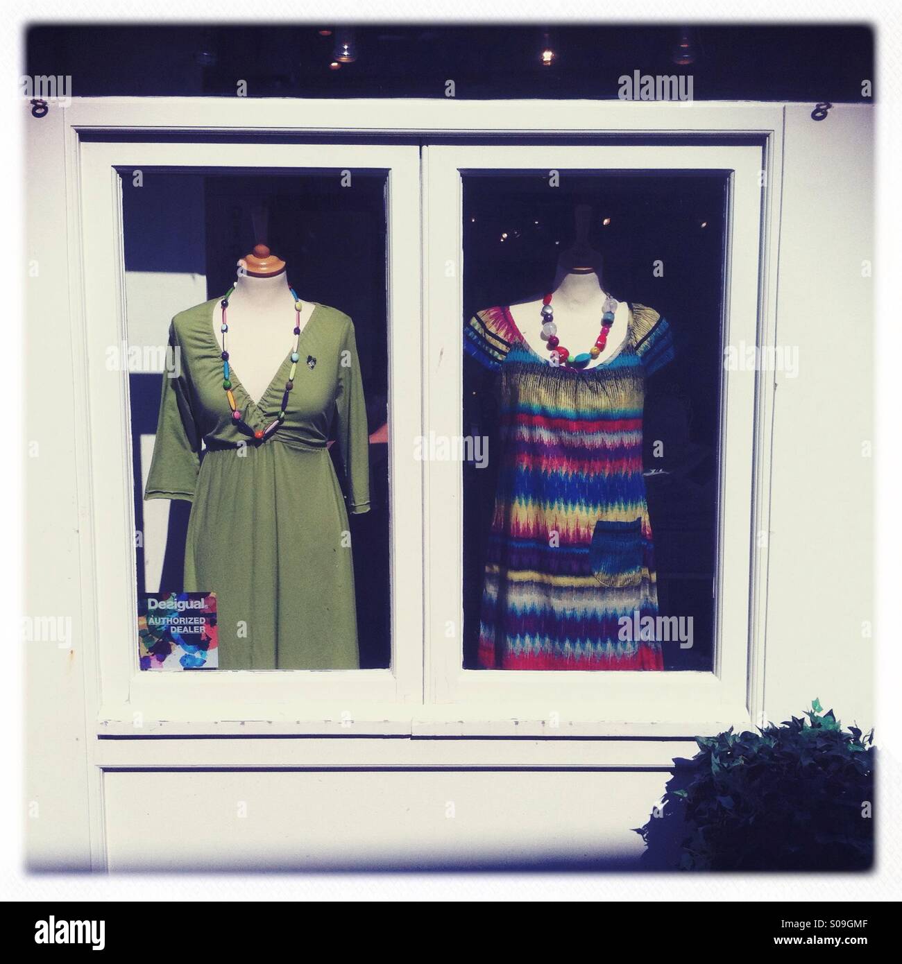 Figures in window Stock Photo - Alamy