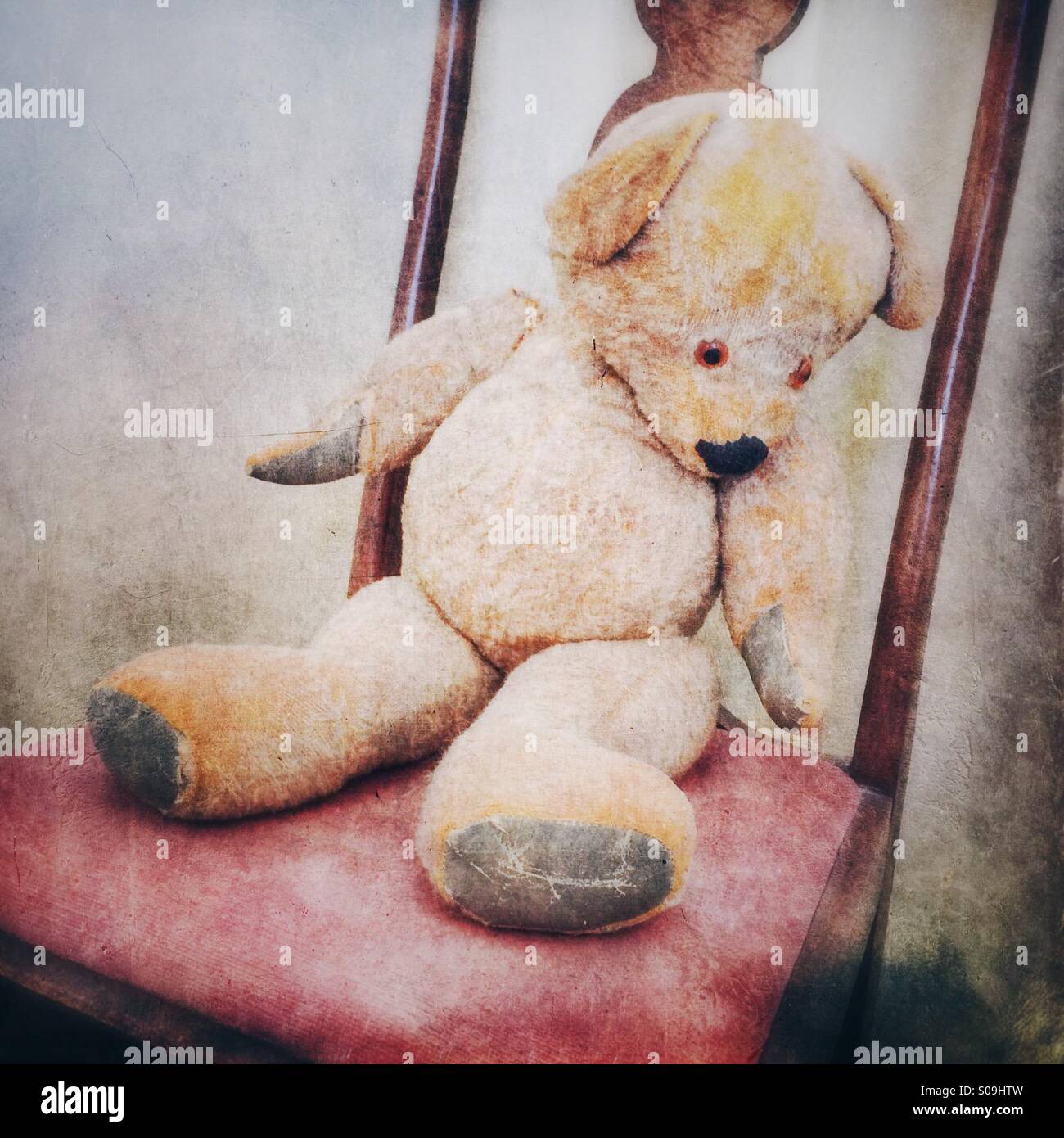 Teddy bear sitting on chair hi-res stock photography and images - Alamy