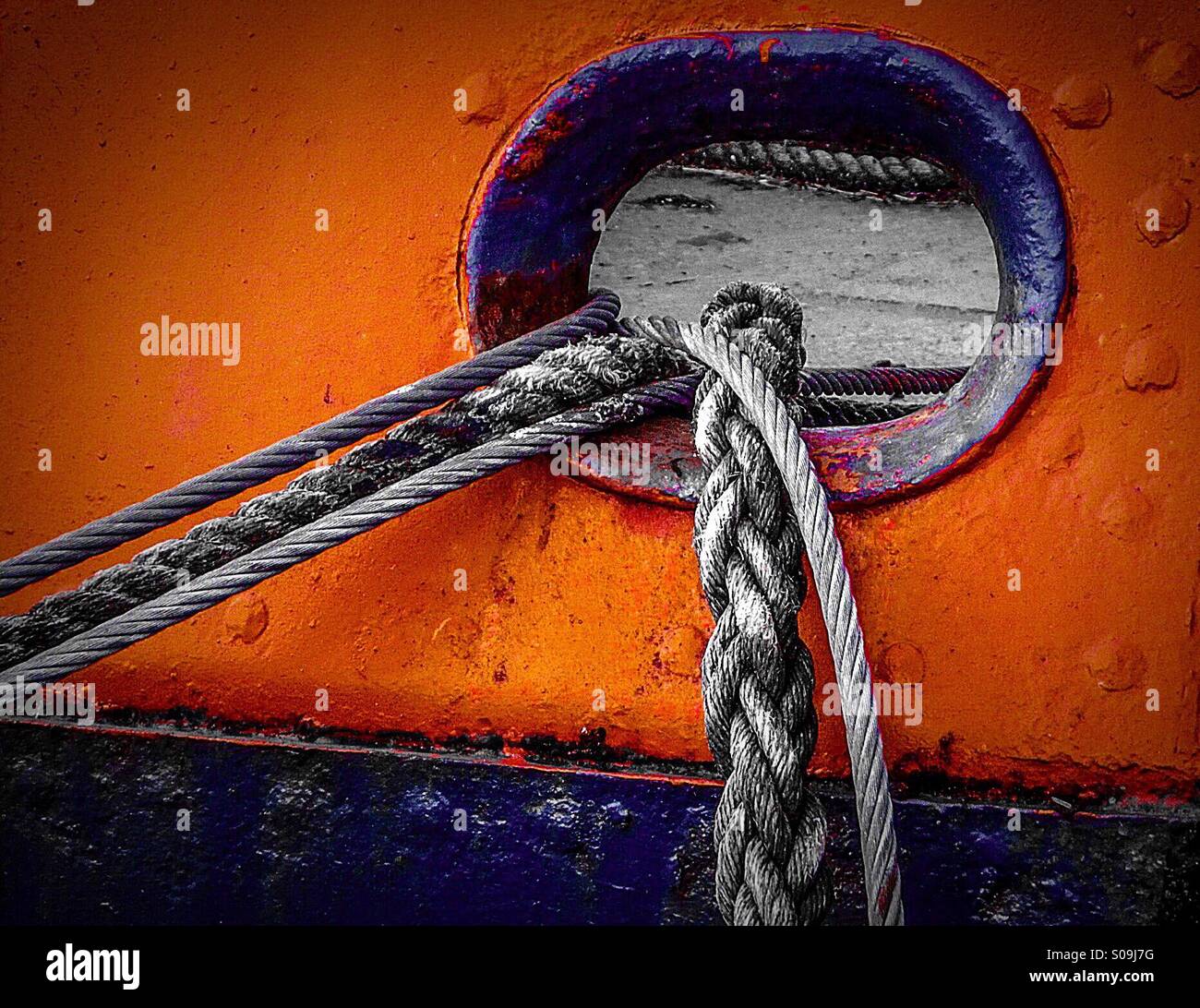 Held up by old rope Stock Photo - Alamy