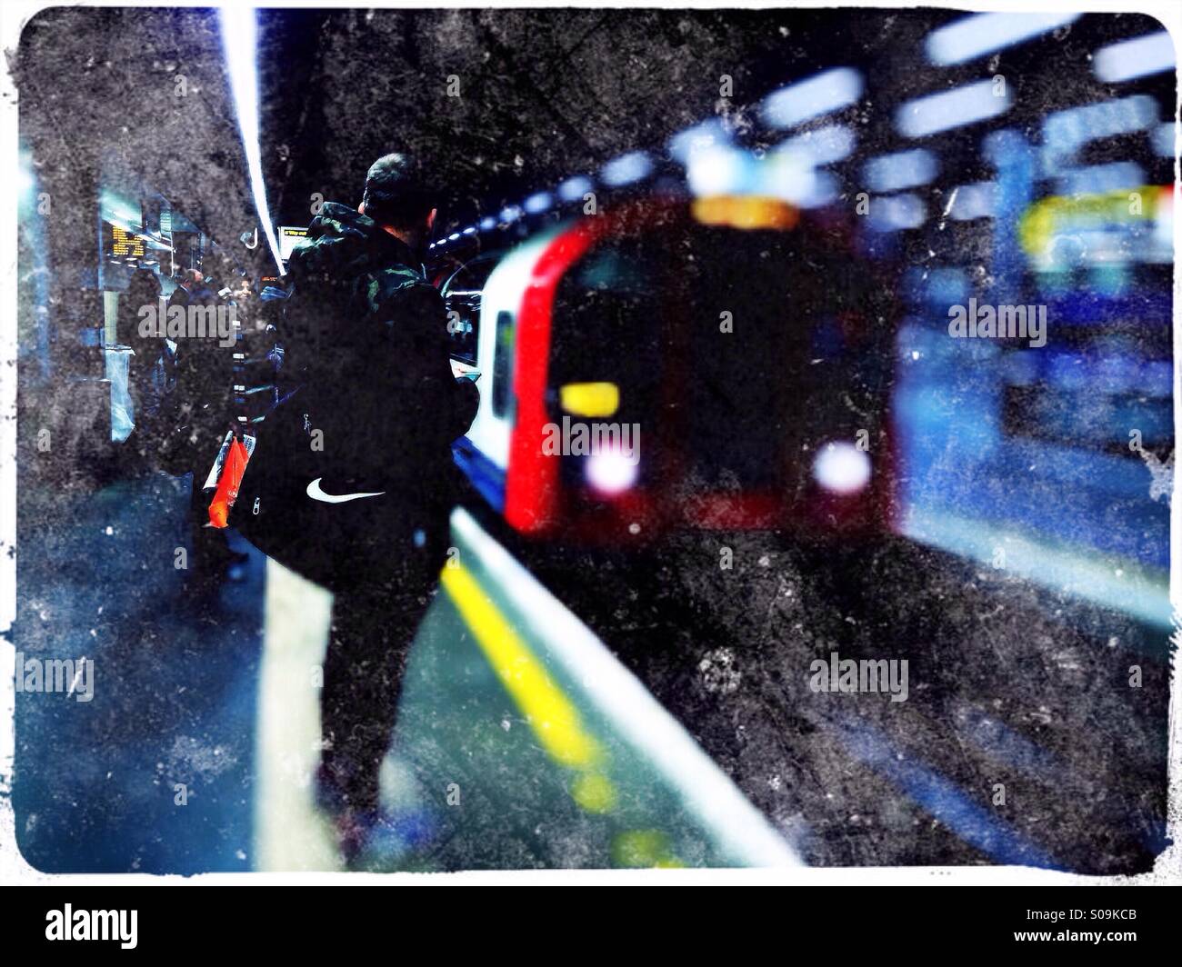 Central Line tube train arriving at platform, Stratford station, London ...