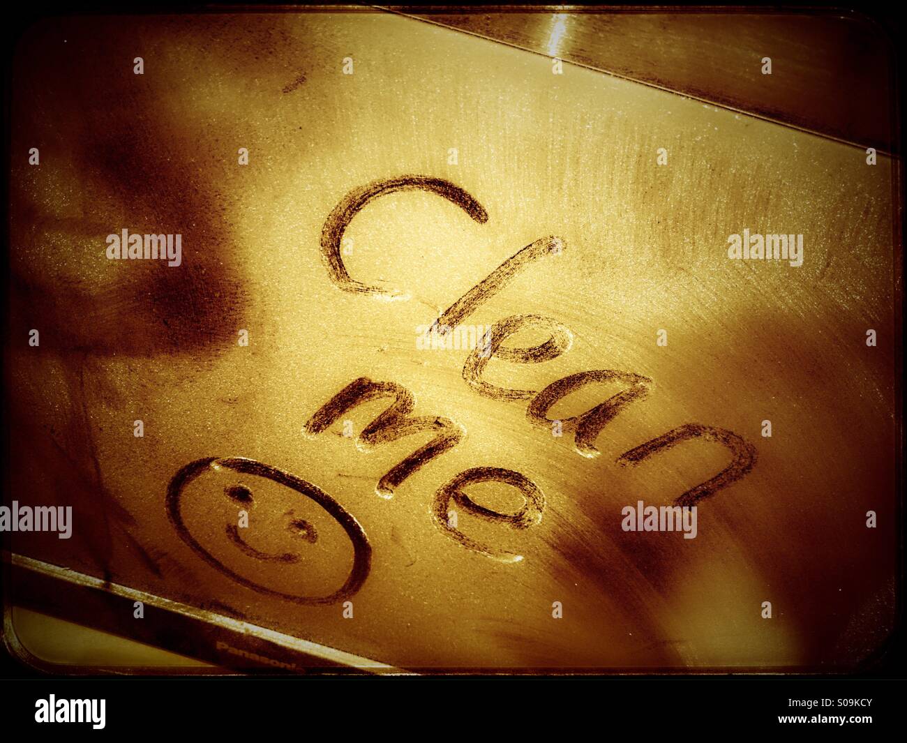 Clean me written in dust Stock Photo - Alamy