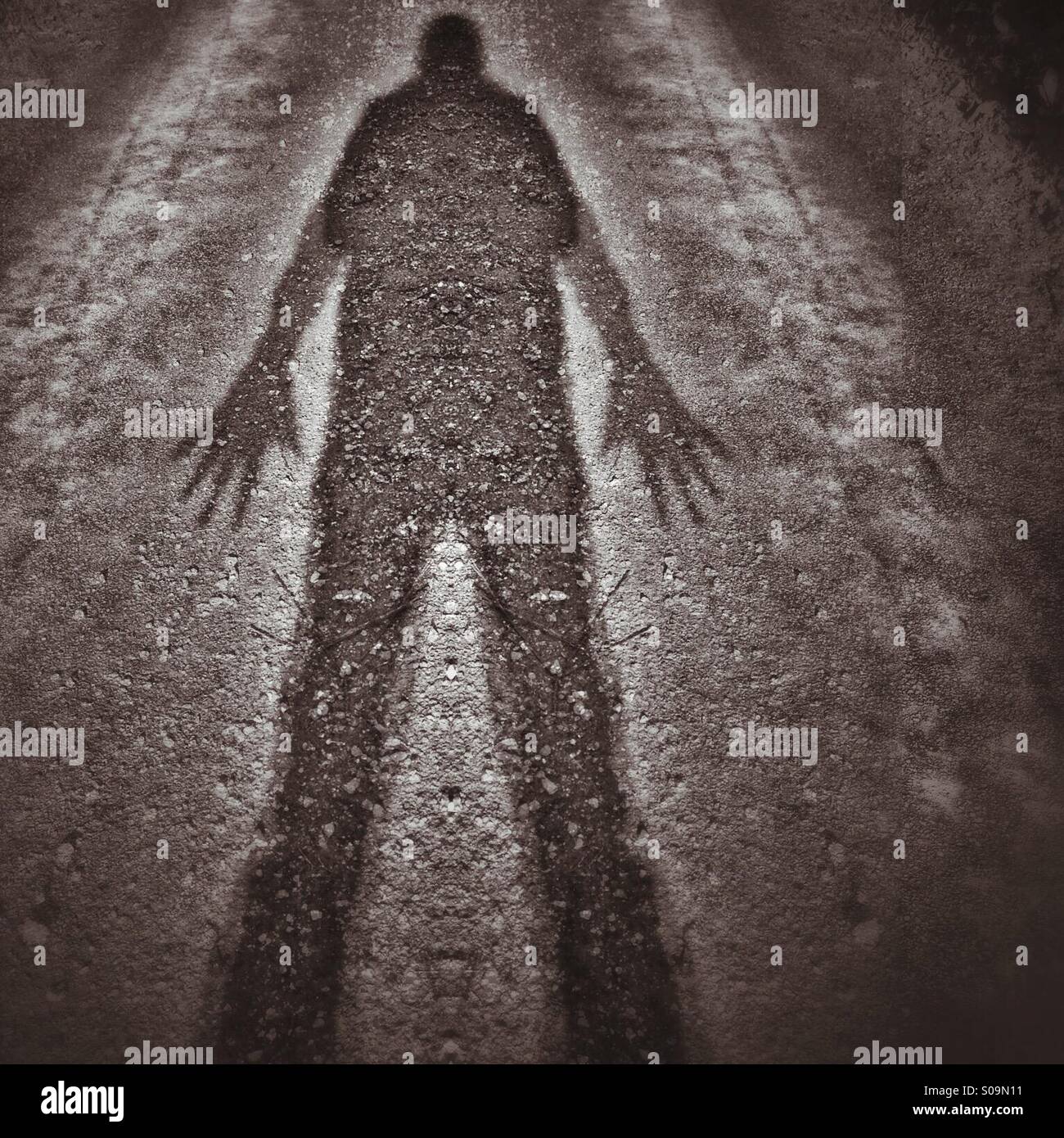 Scary shadow with huge hands Stock Photo - Alamy