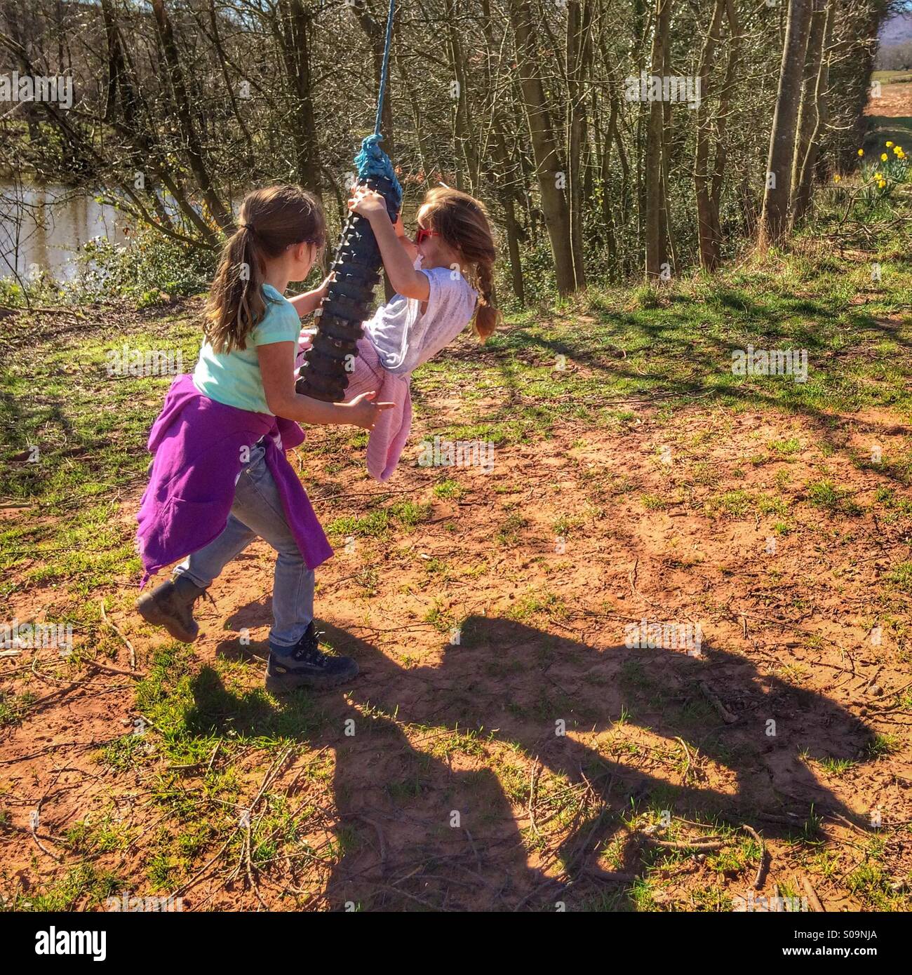 Girls on a swing hi-res stock photography and images - Alamy