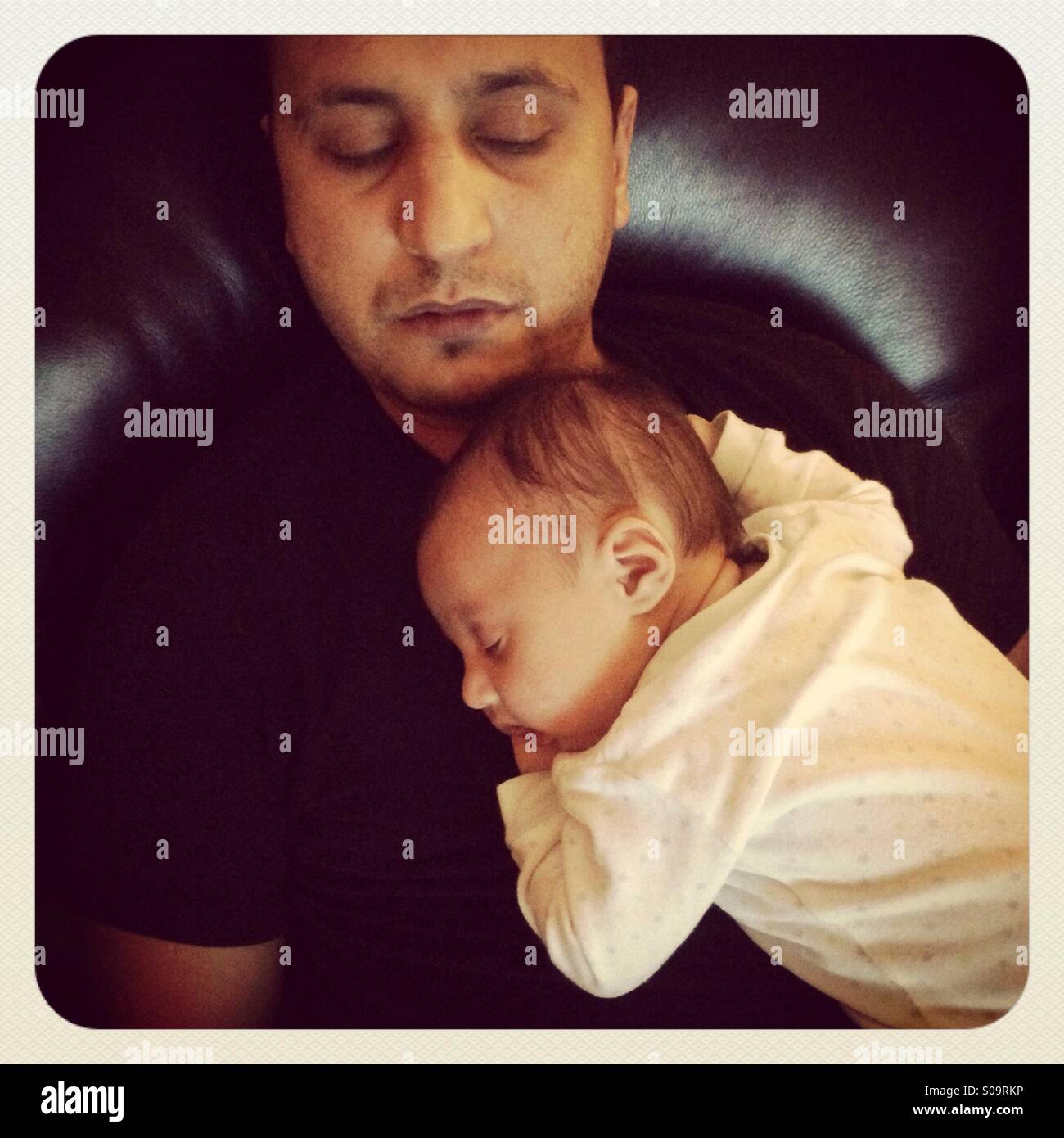 Sleeping baby and daddy Stock Photo - Alamy