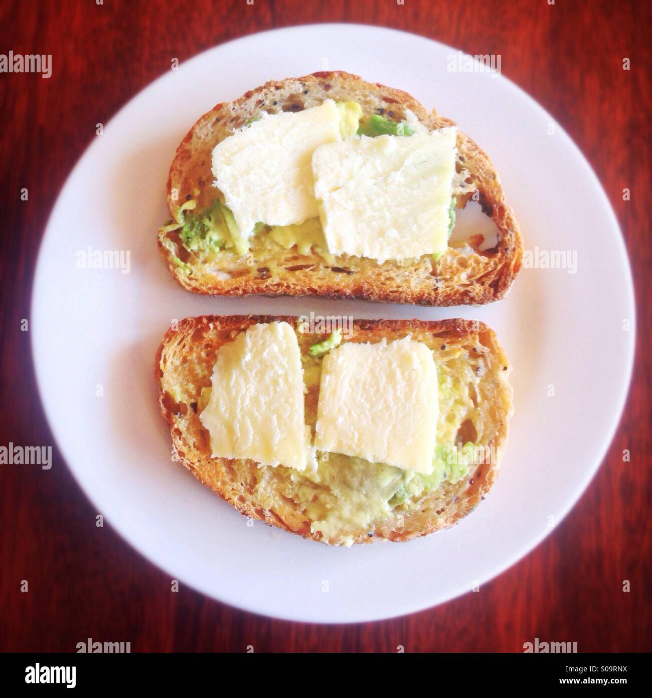 Toast with avocado and Italian cheese Stock Photo - Alamy