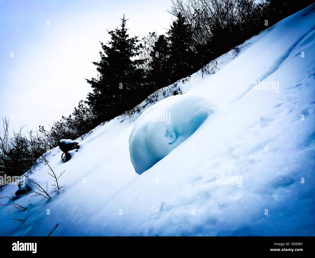 Snow sliding down a hillside, a little avalanche Stock Photo - Alamy