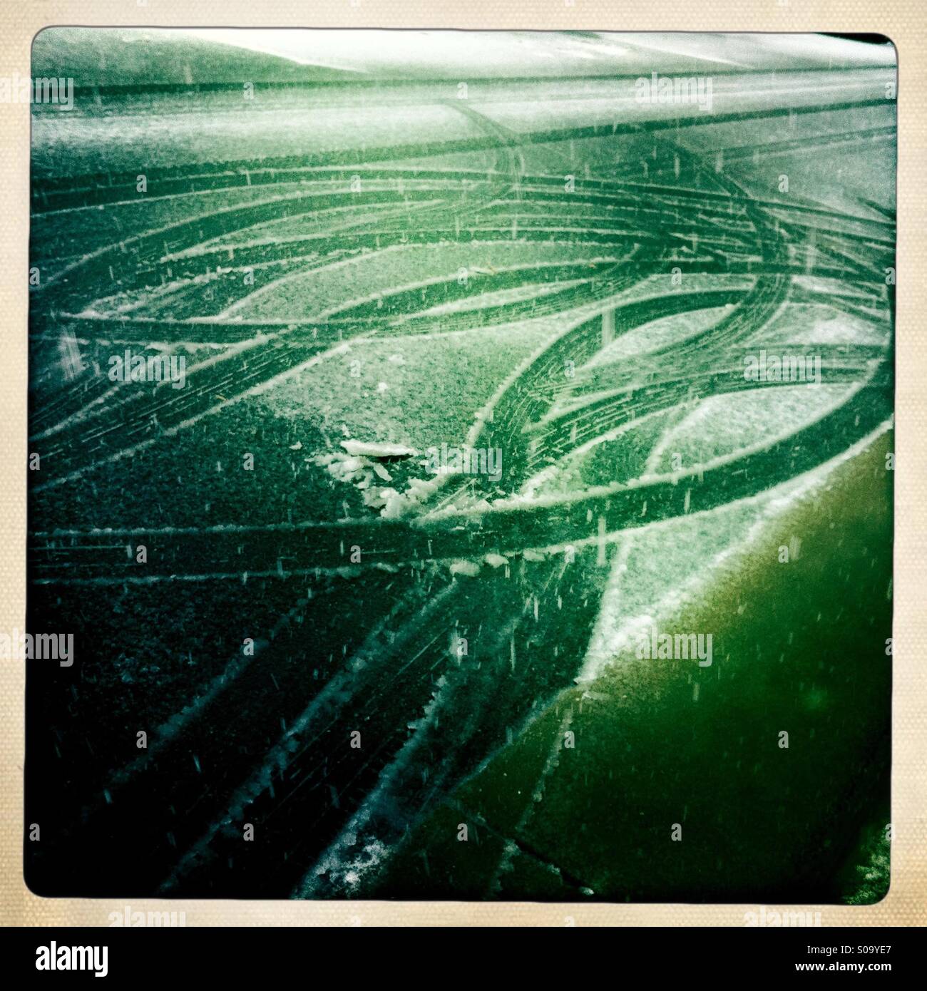 Car wheel tracks in the snow Stock Photo - Alamy