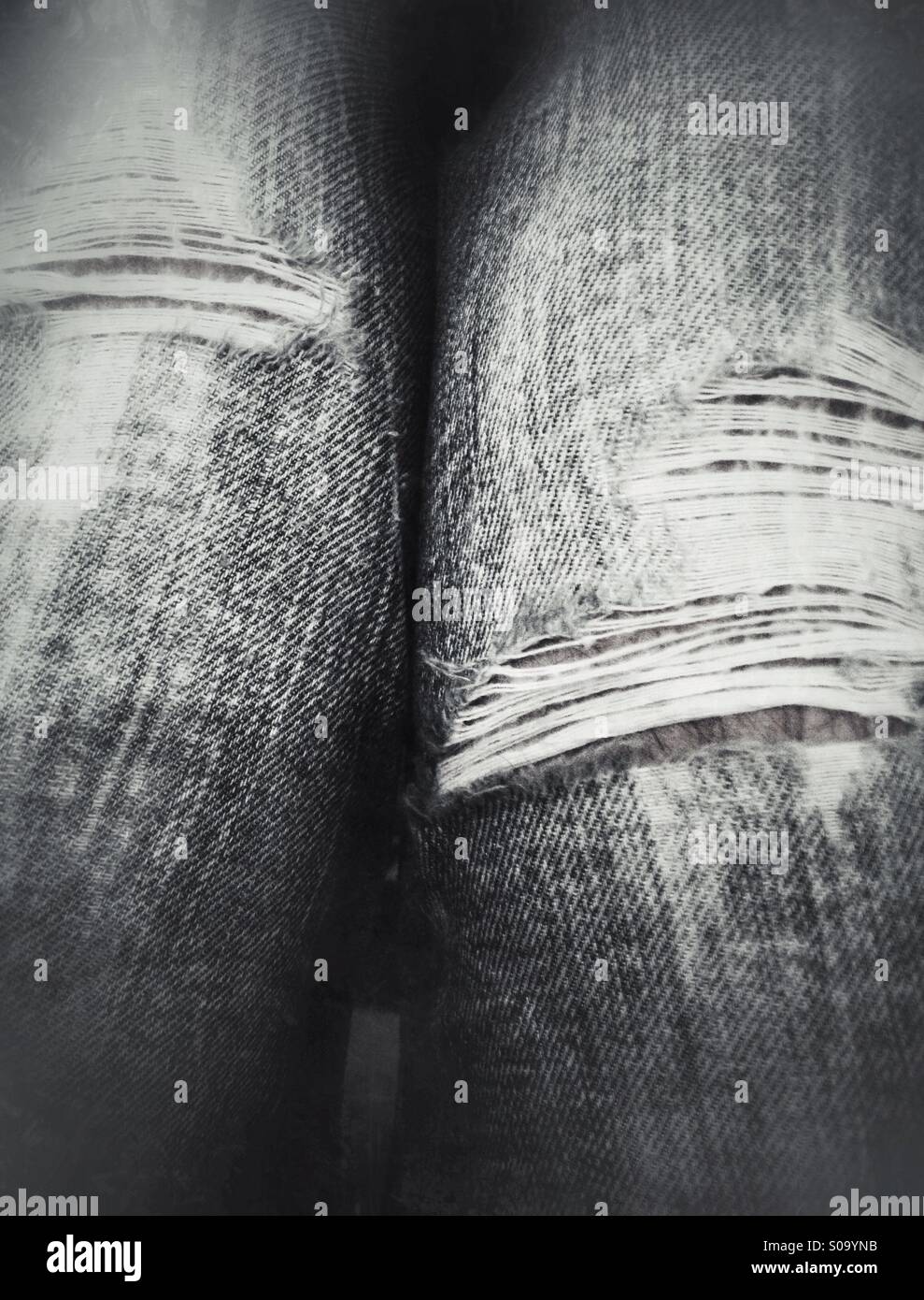 Torn jean hi-res stock photography and images - Alamy