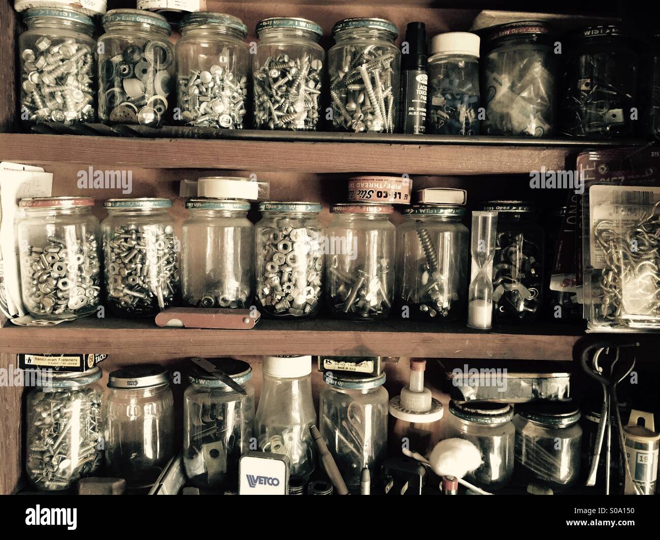 jars filled with different kinds of bolts and screws Stock Photo - Alamy