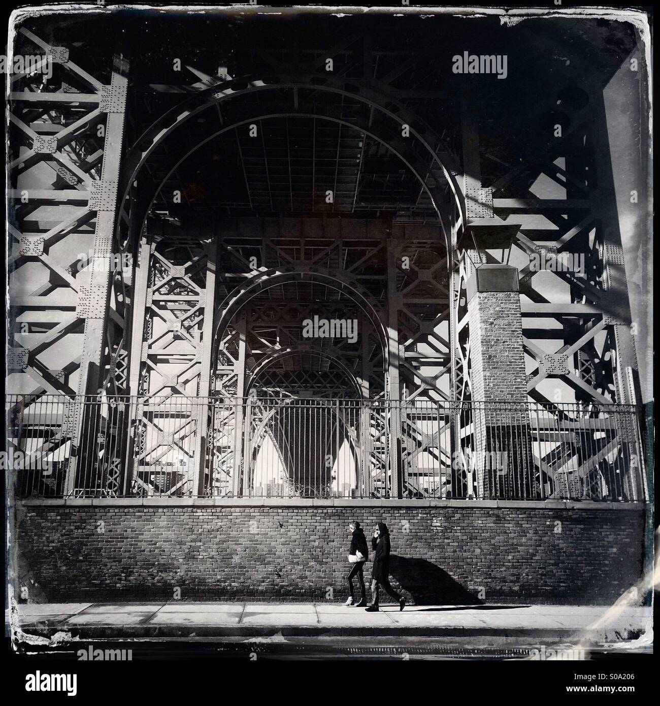 People walking under bridge hi-res stock photography and images - Alamy