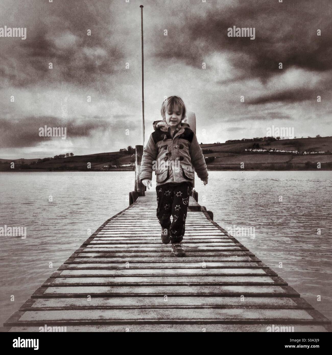 Walking on a jetty Stock Photo - Alamy