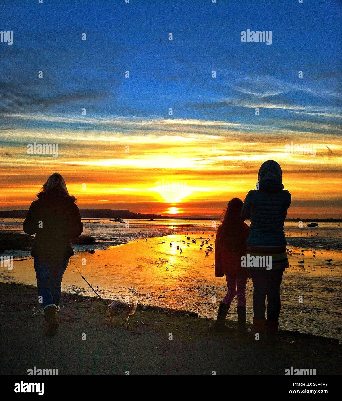 Women watching the sunset hi-res stock photography and images - Alamy