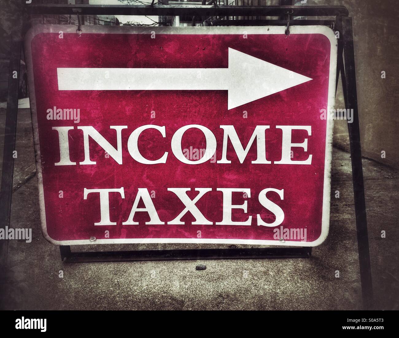 Income taxes sign Stock Photo - Alamy