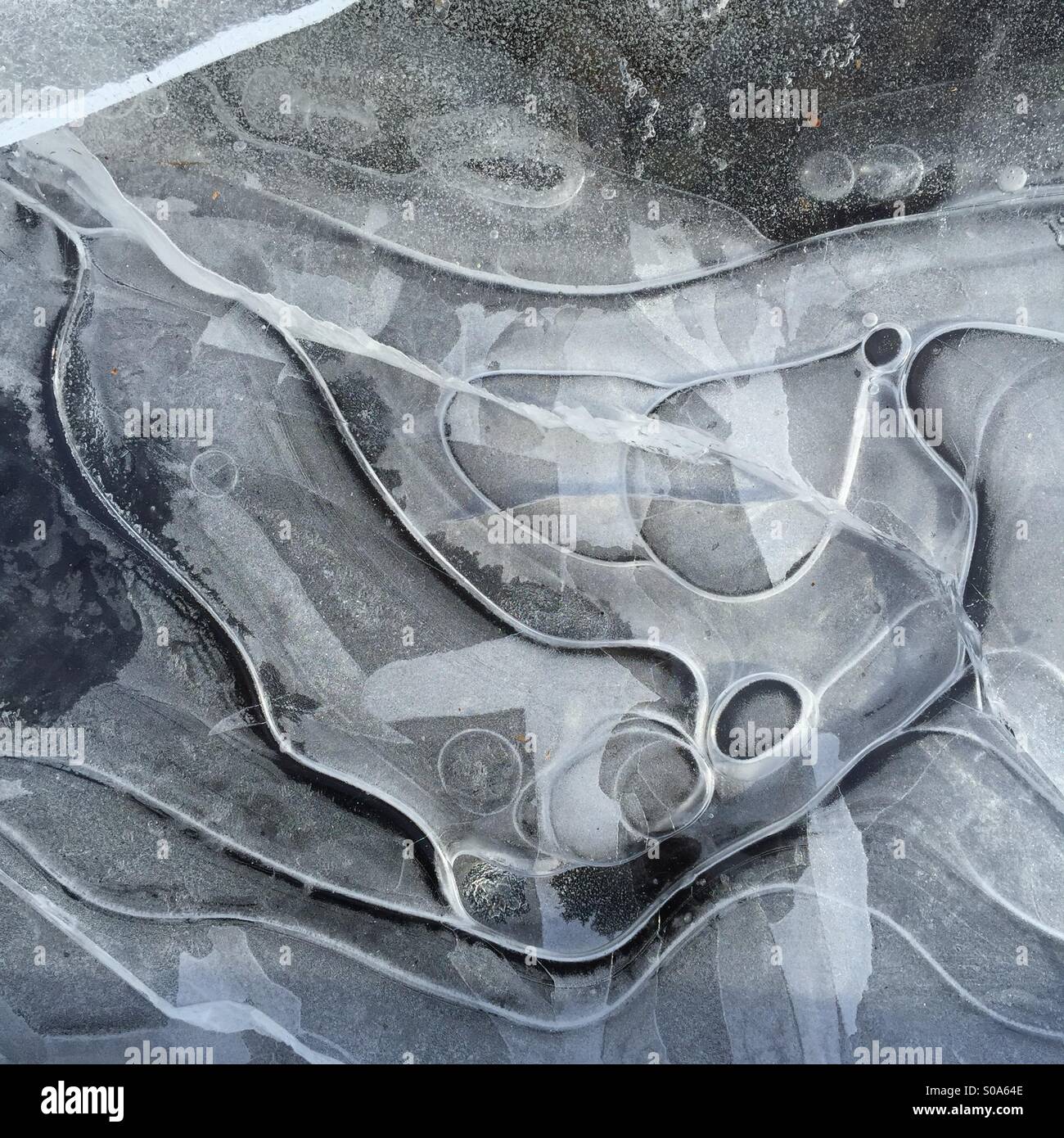 Ice pattern design on Frozen lake in black and white Stock Photo - Alamy