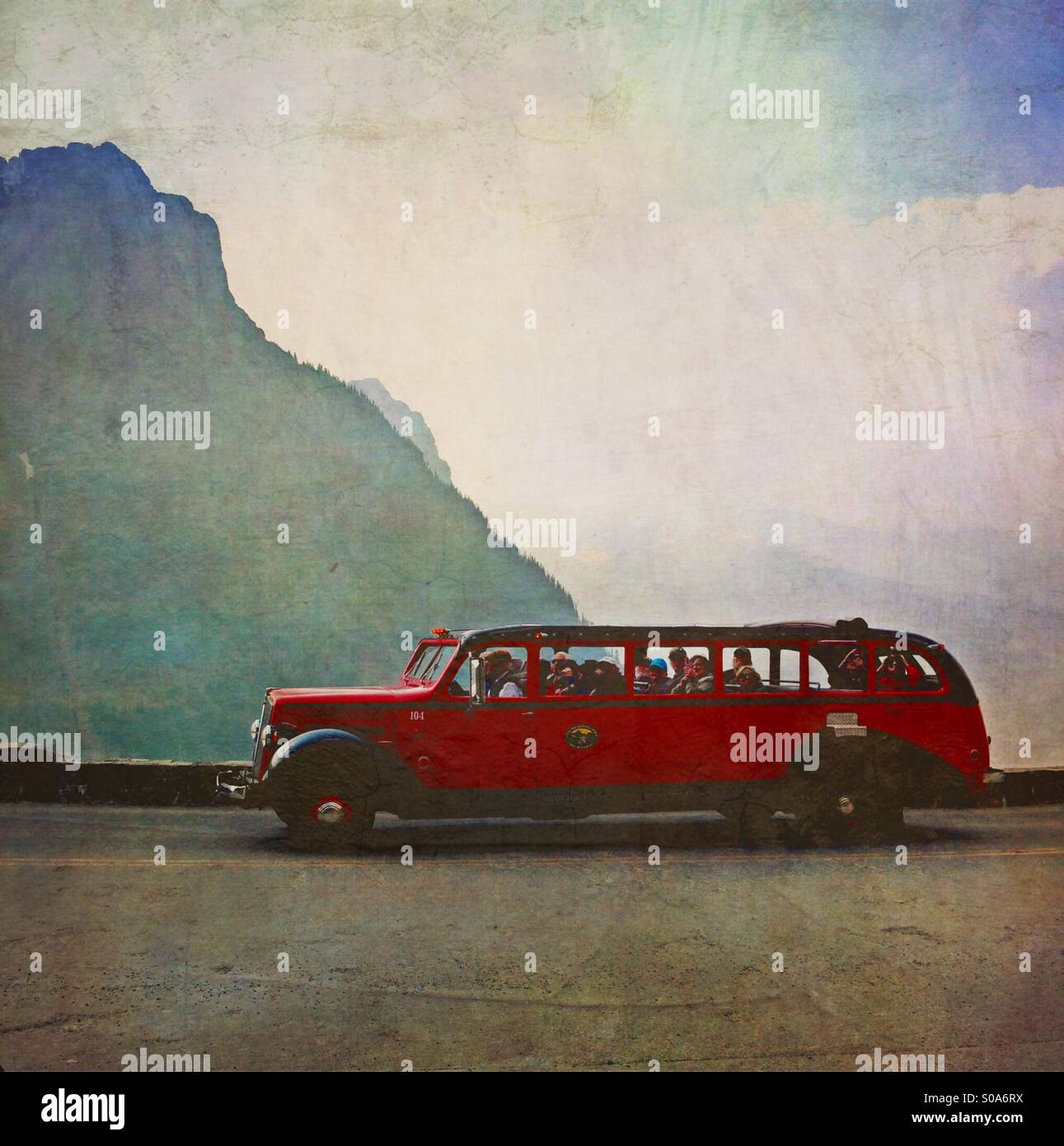 Red Jammer tour bus in Glacier National Park Stock Photo - Alamy