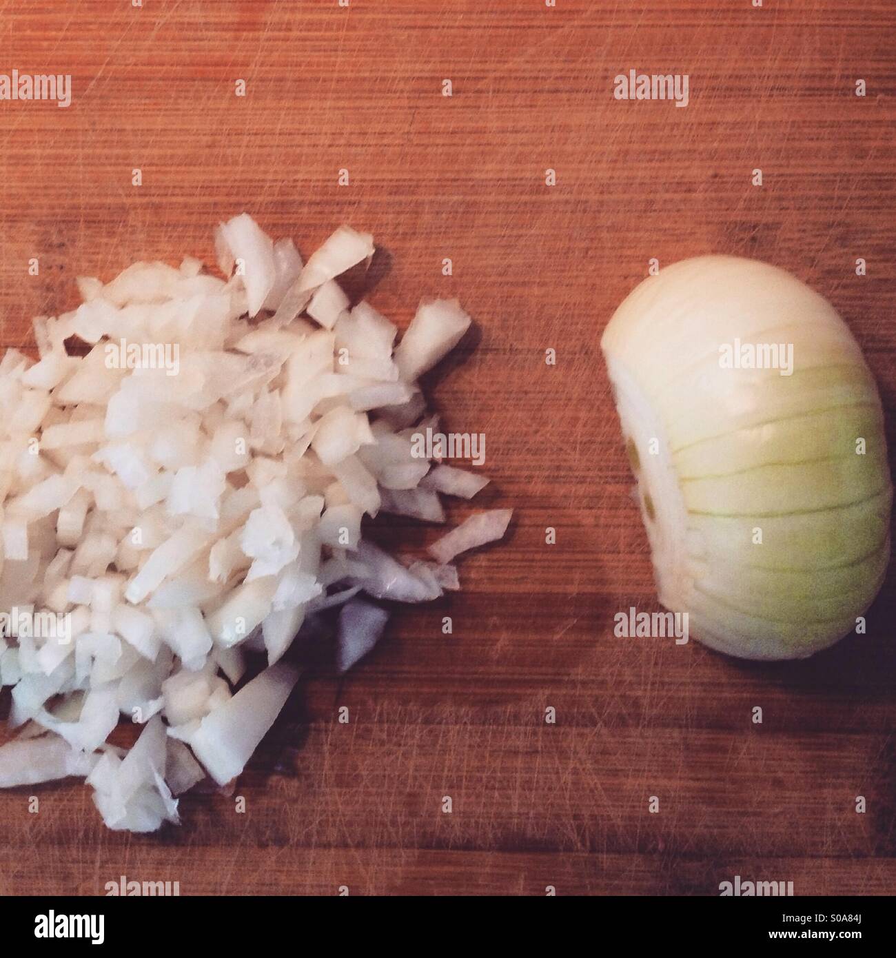 Chopped onion on wooden board Stock Photo - Alamy