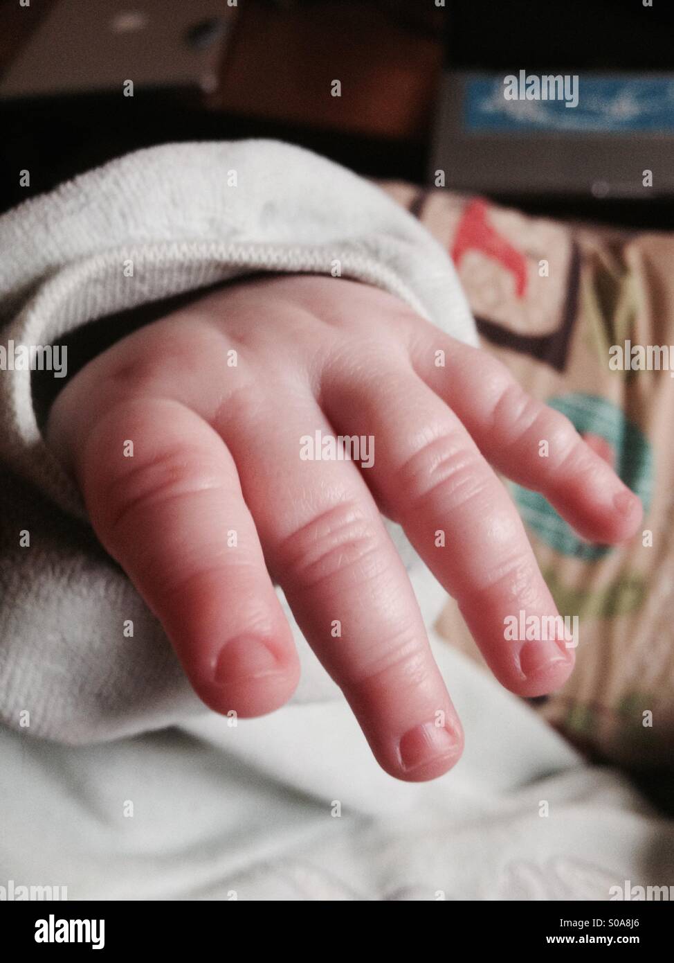 Baby hand hi-res stock photography and images - Alamy