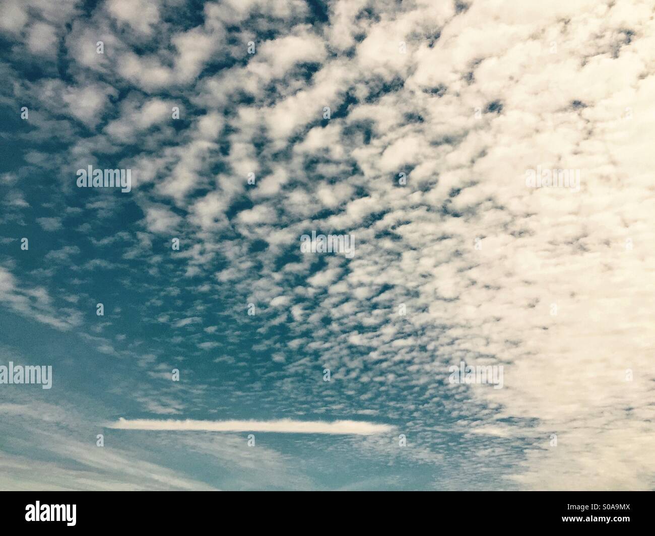 Unusual cloud formations with a blue sky Stock Photo - Alamy