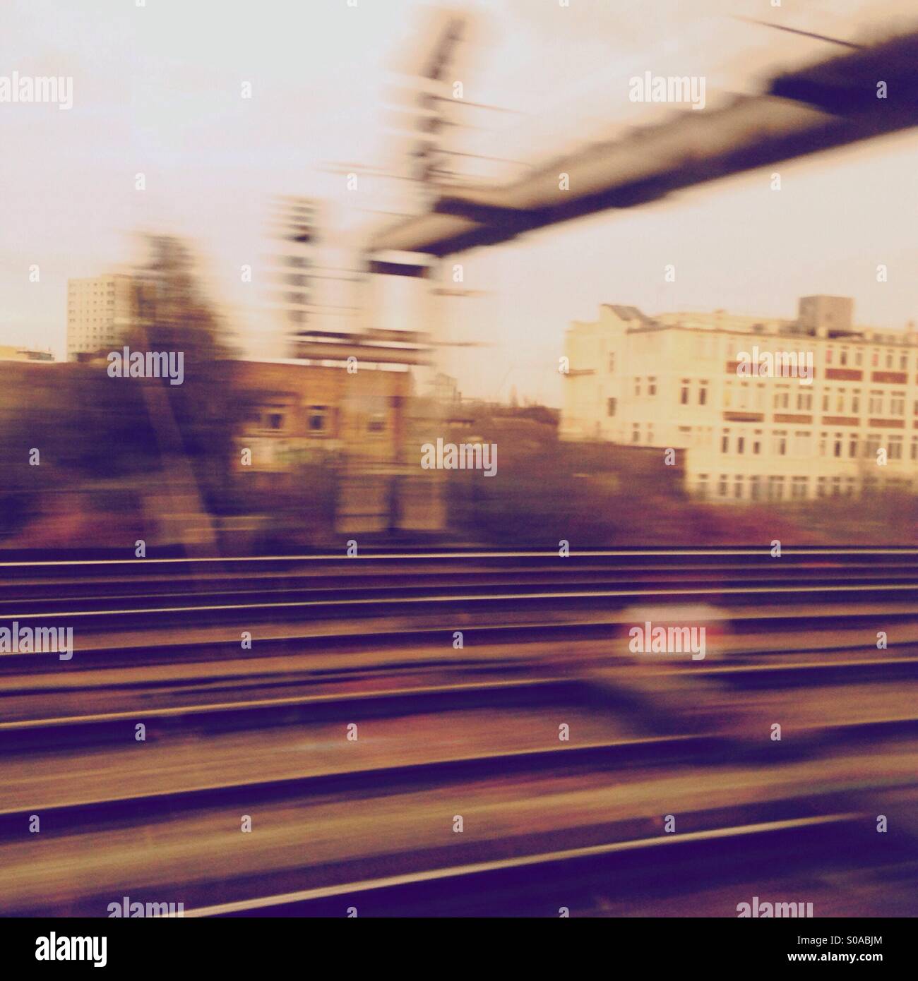 Train journey, looking out the window at the train tracks zooming past ...