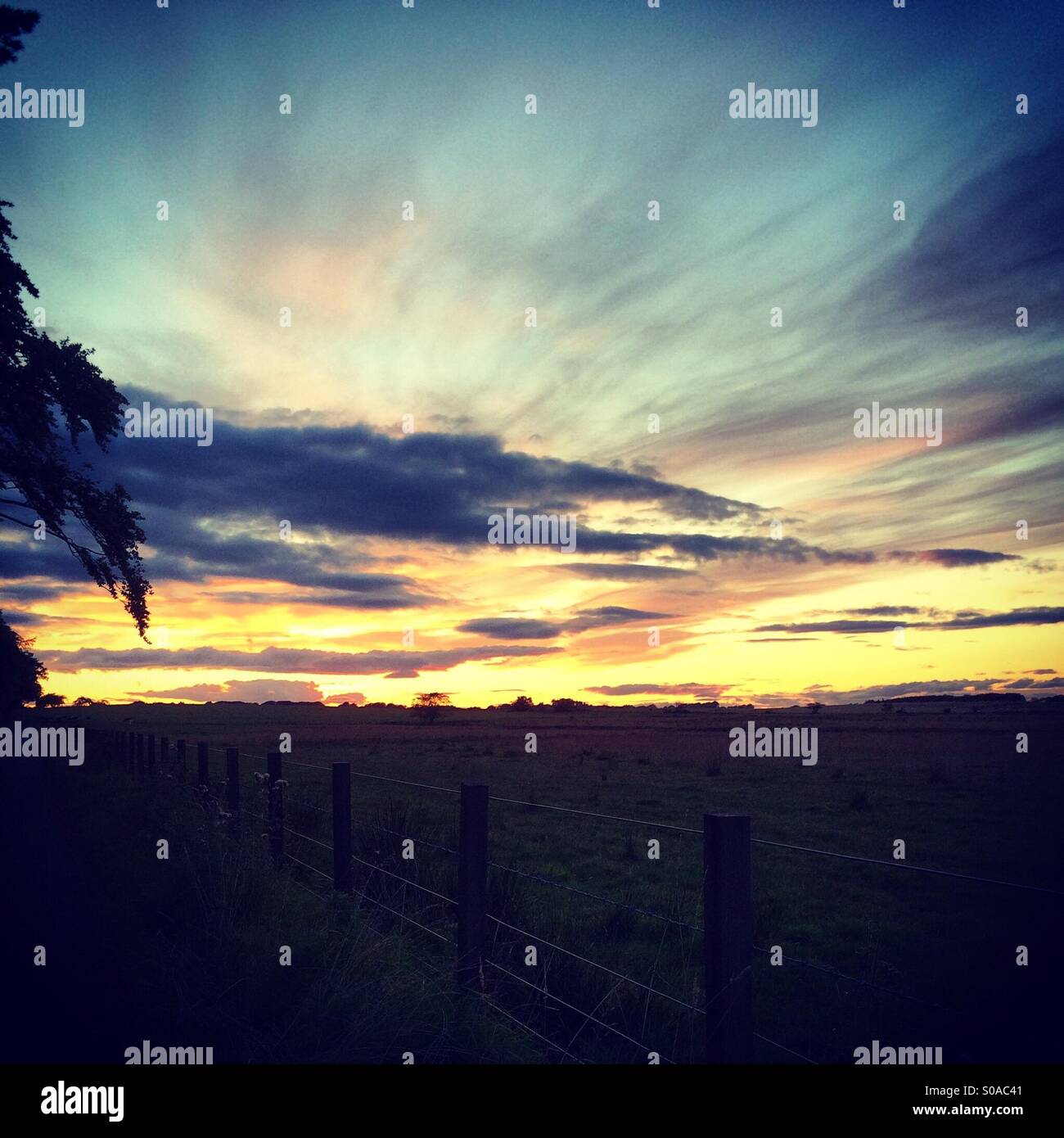 Sunset in the country in Scotland Stock Photo - Alamy