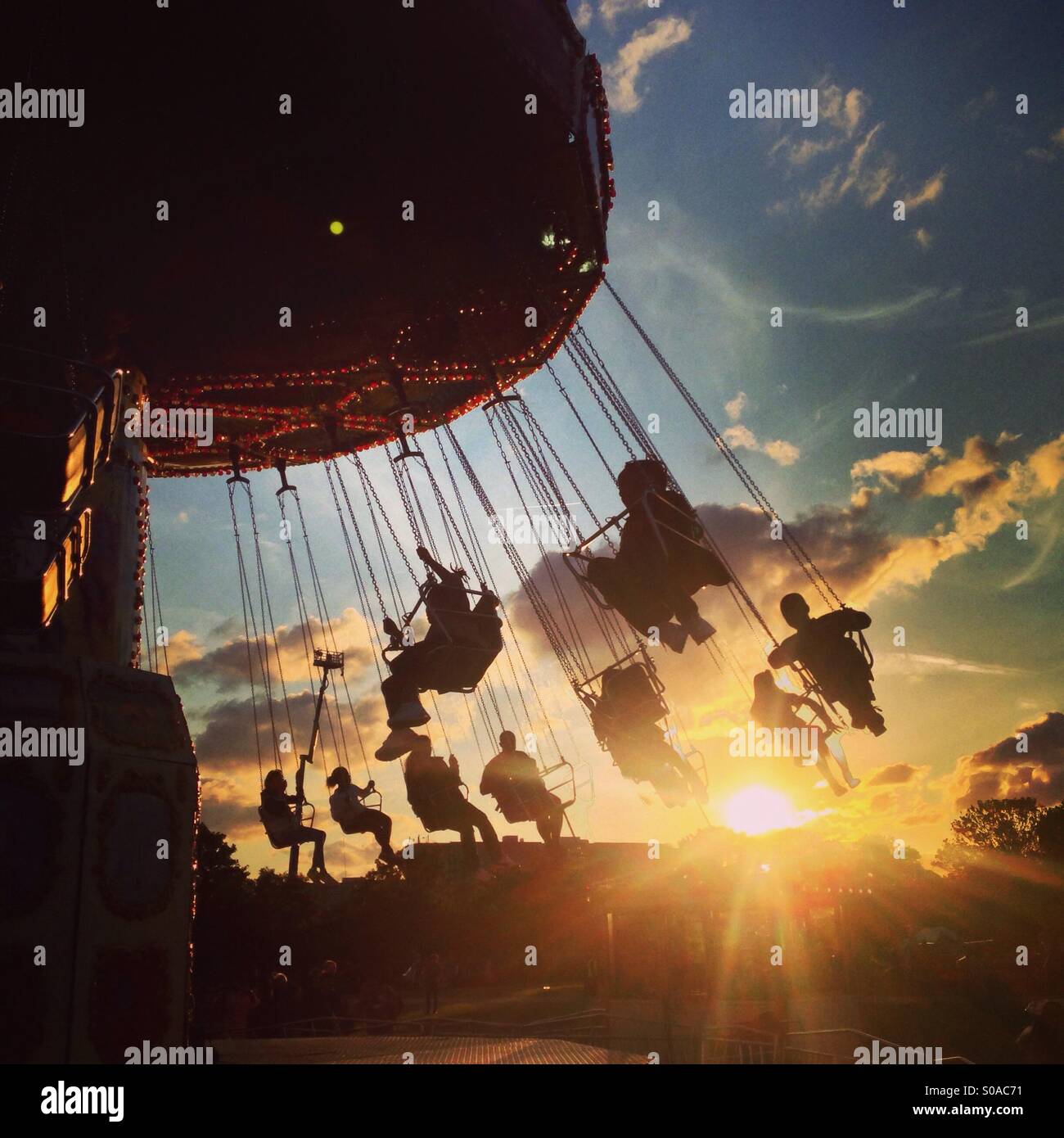 Fair fairground funfair sunset hi-res stock photography and images - Alamy