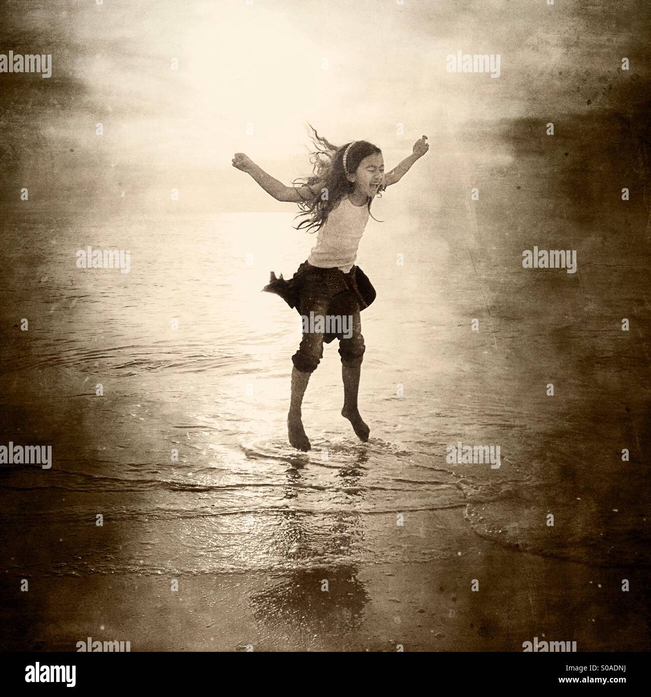 Girl jumping water hi-res stock photography and images - Alamy