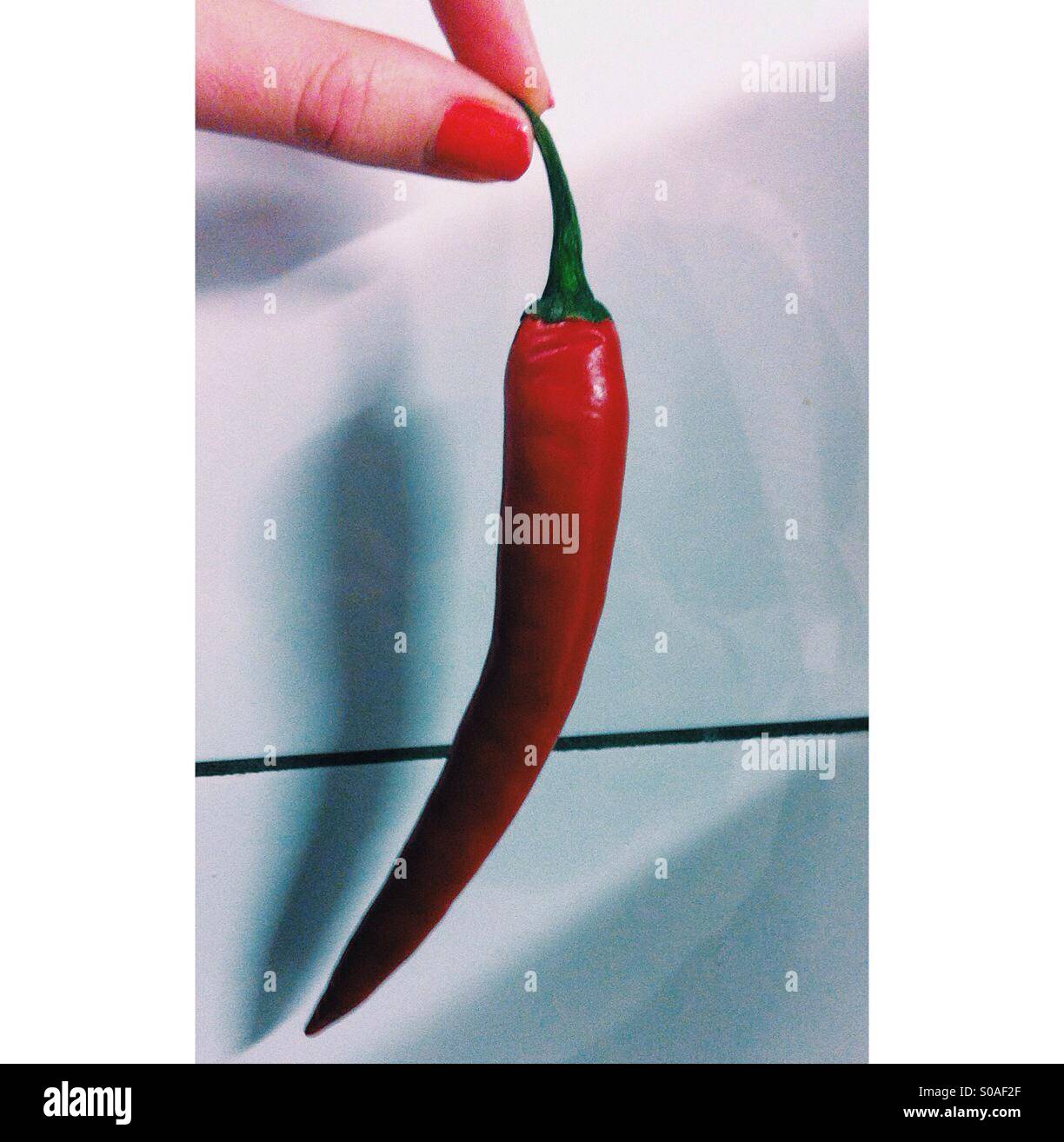 Chilli food red hot spicy hand fingers nail polish hi-res stock ...