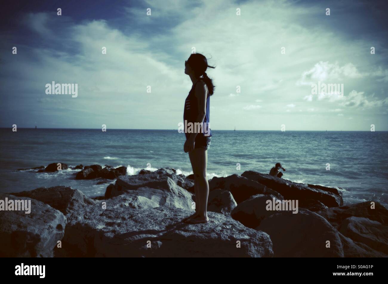 Women by the ocean Stock Photo - Alamy